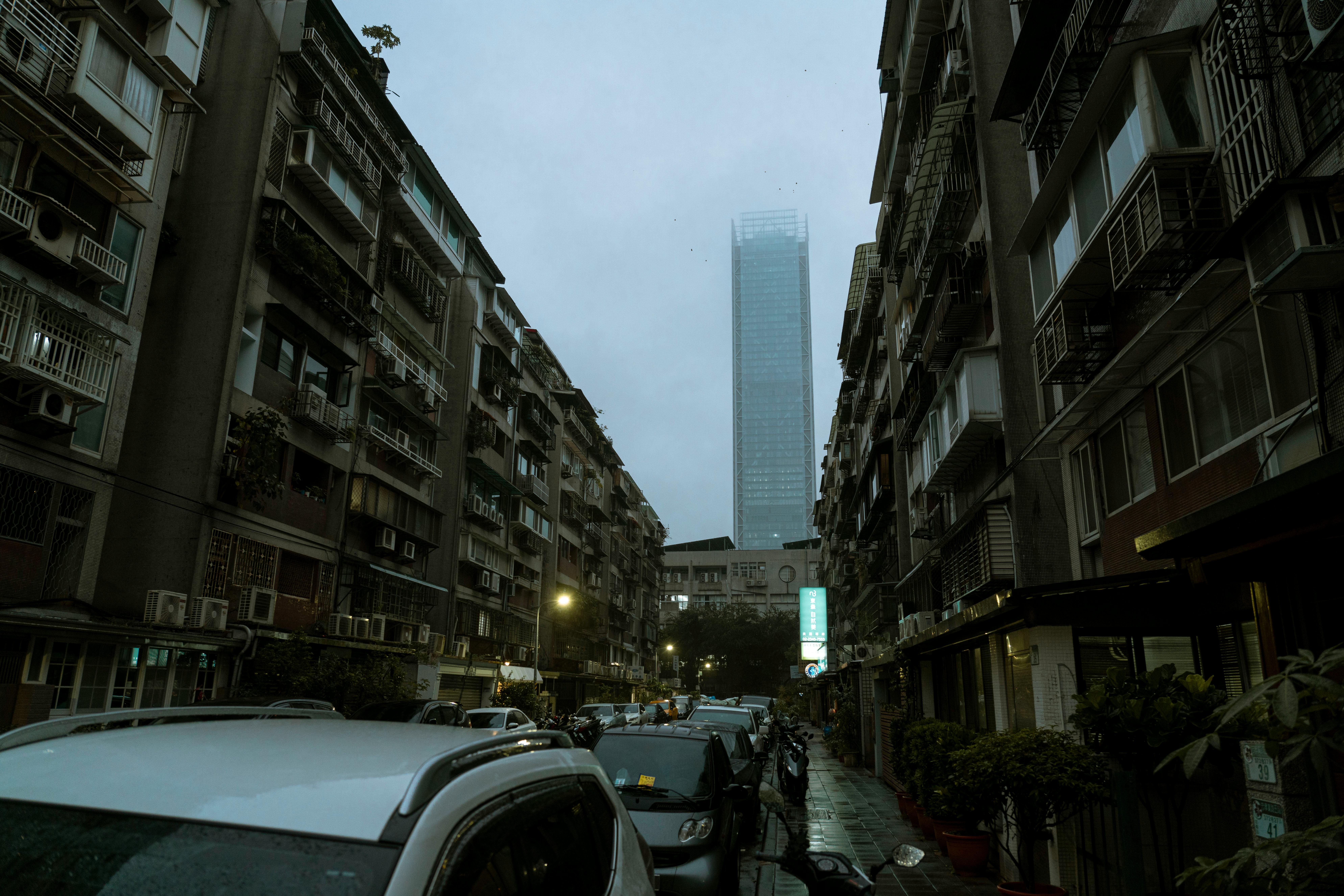 Street with the View of a Skyscraper between Blocks of Flats in City ...