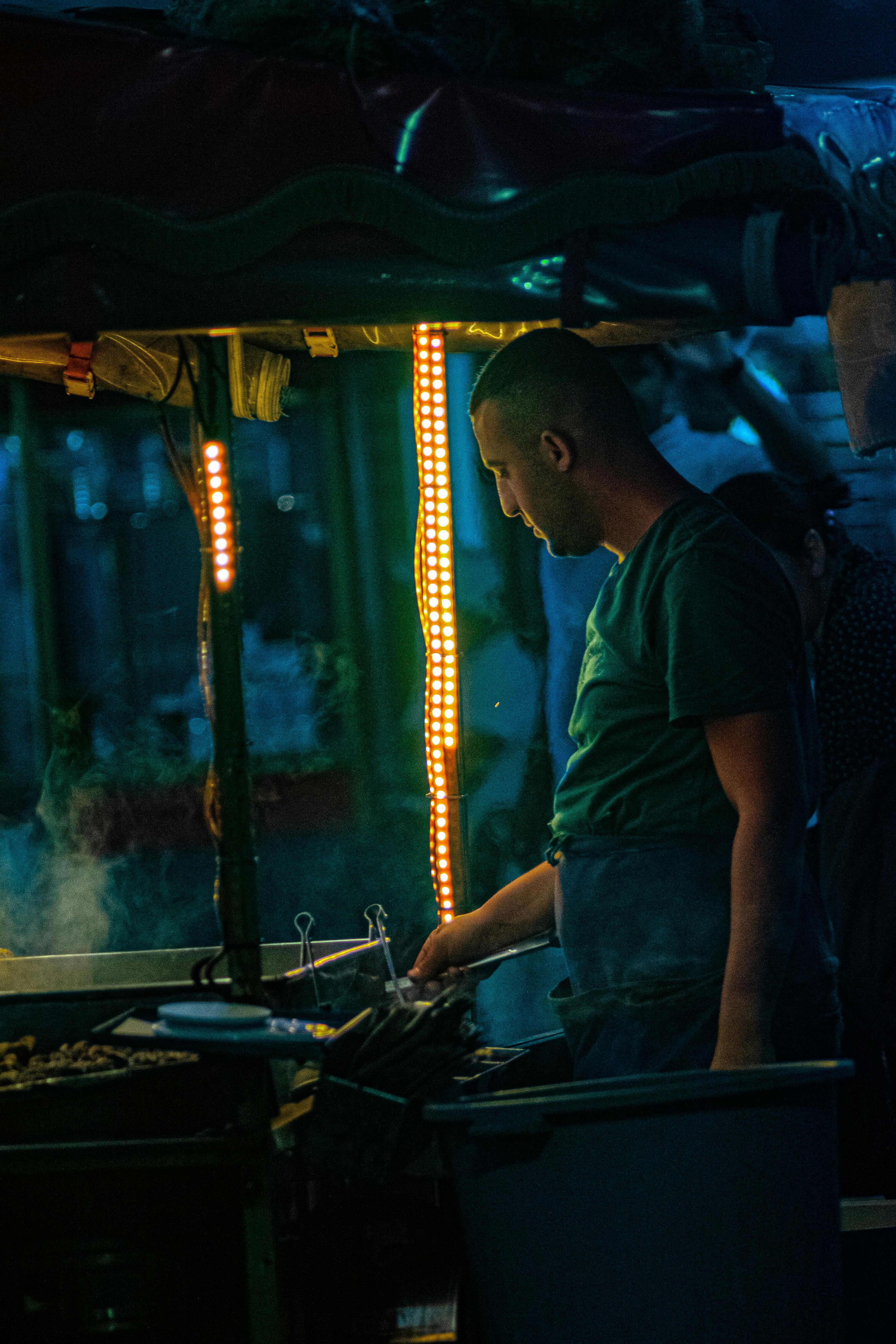A Man Standing at the Bar Counter · Free Stock Photo