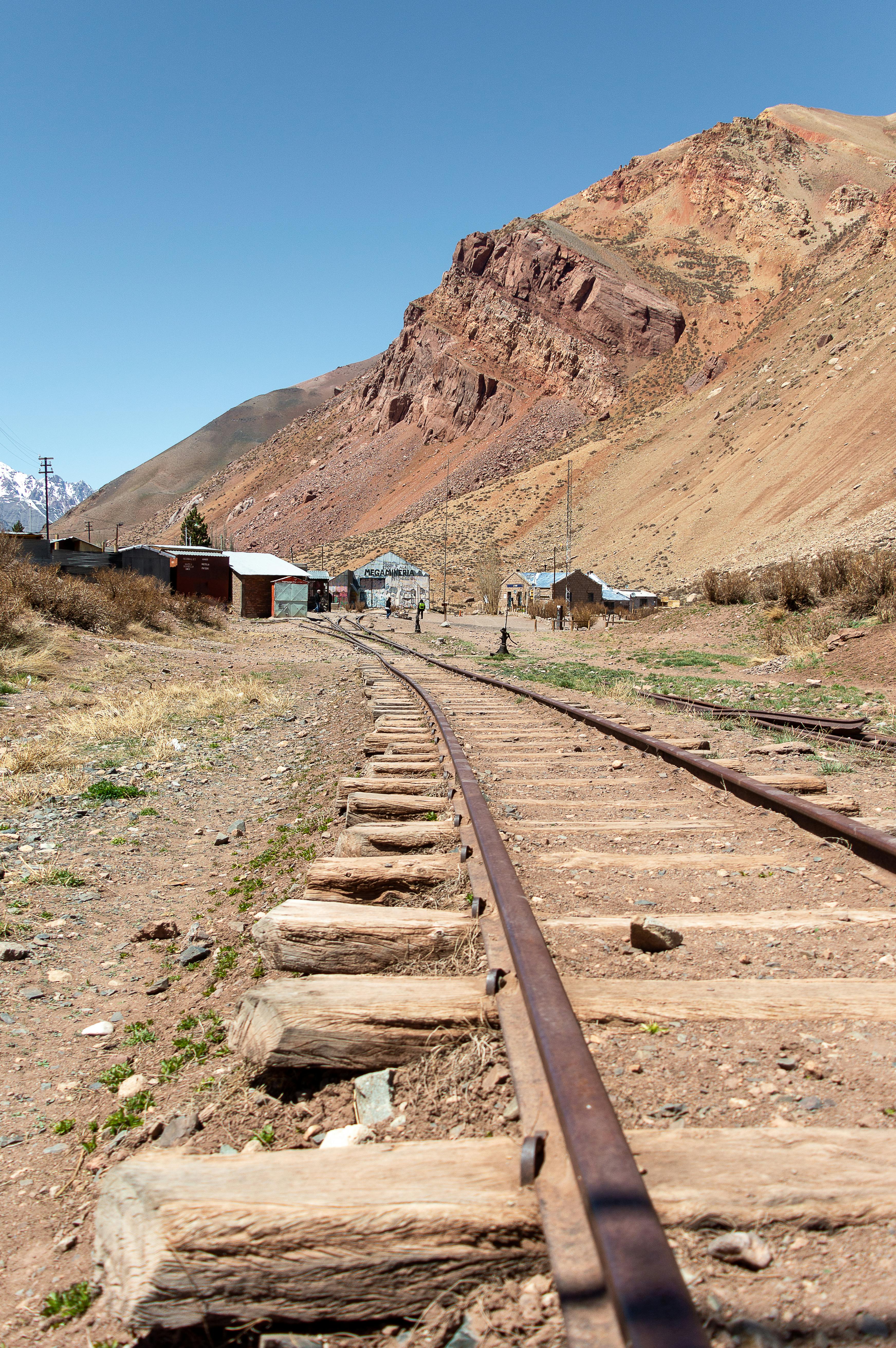 Brown Wooden Train Rail Near Brown Mountain · Free Stock Photo
