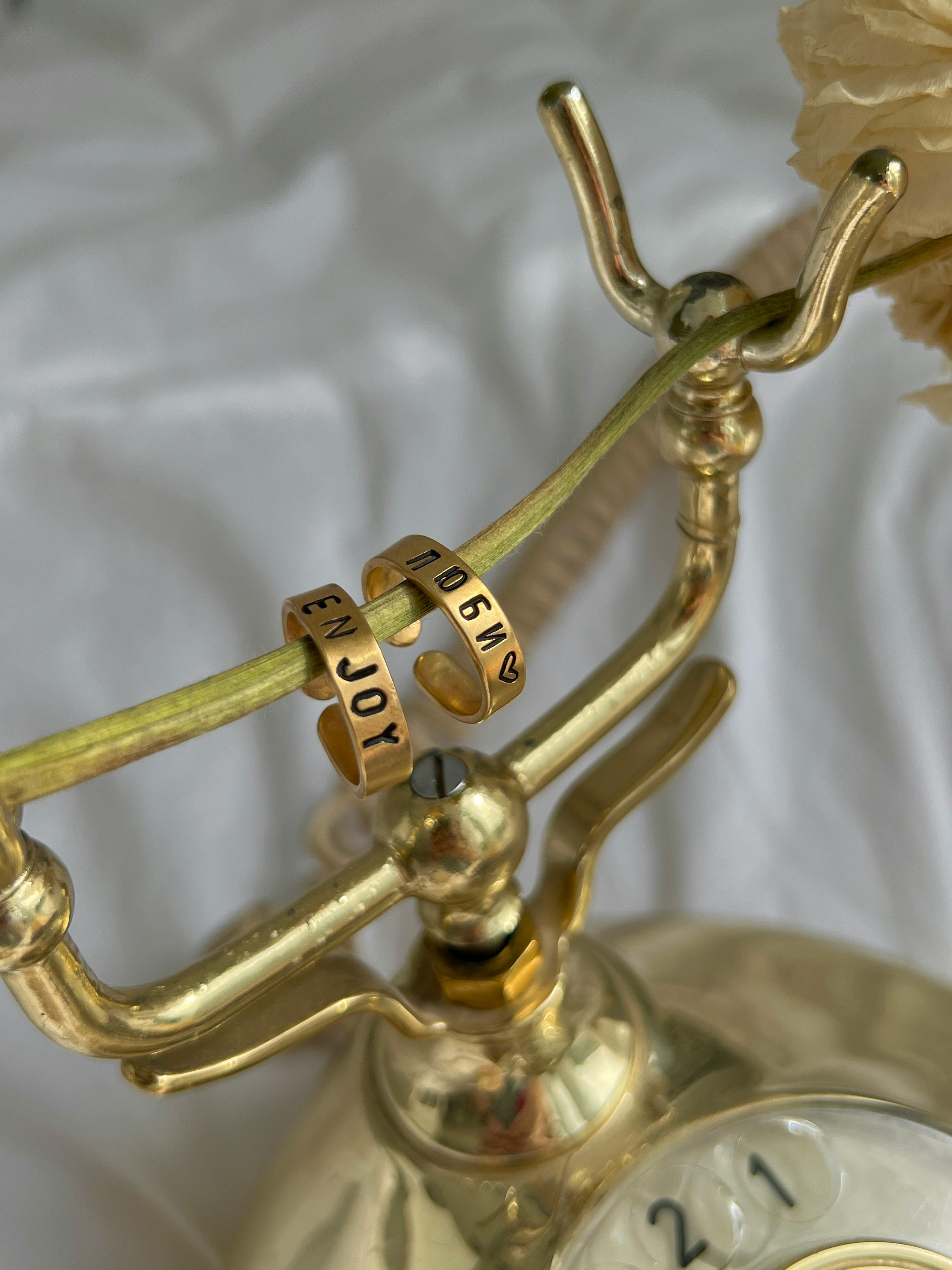 Gold Rings on a Vintage Telephone Holder · Free Stock Photo