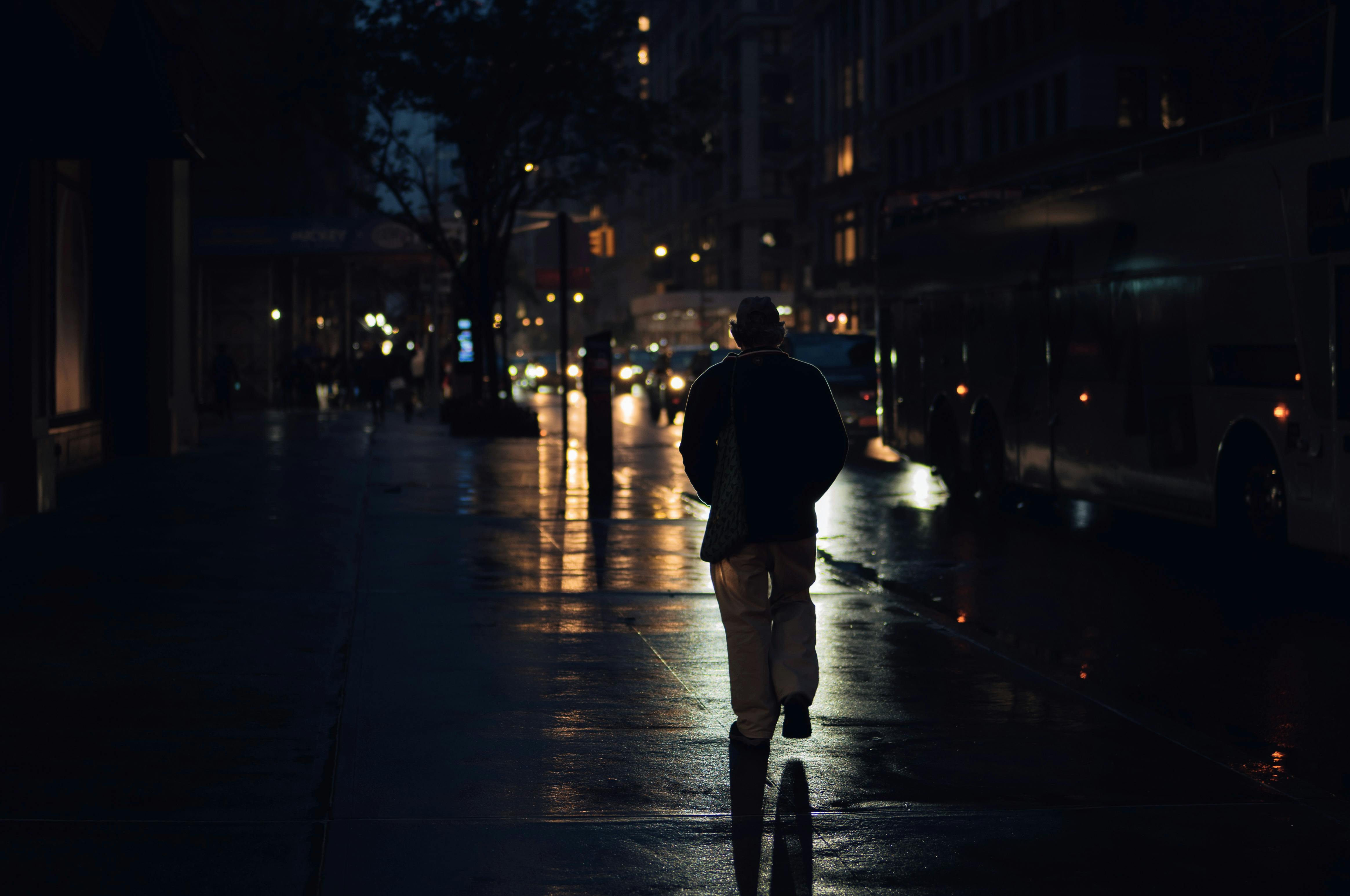 Man Walking Down the City Street at Night · Free Stock Photo