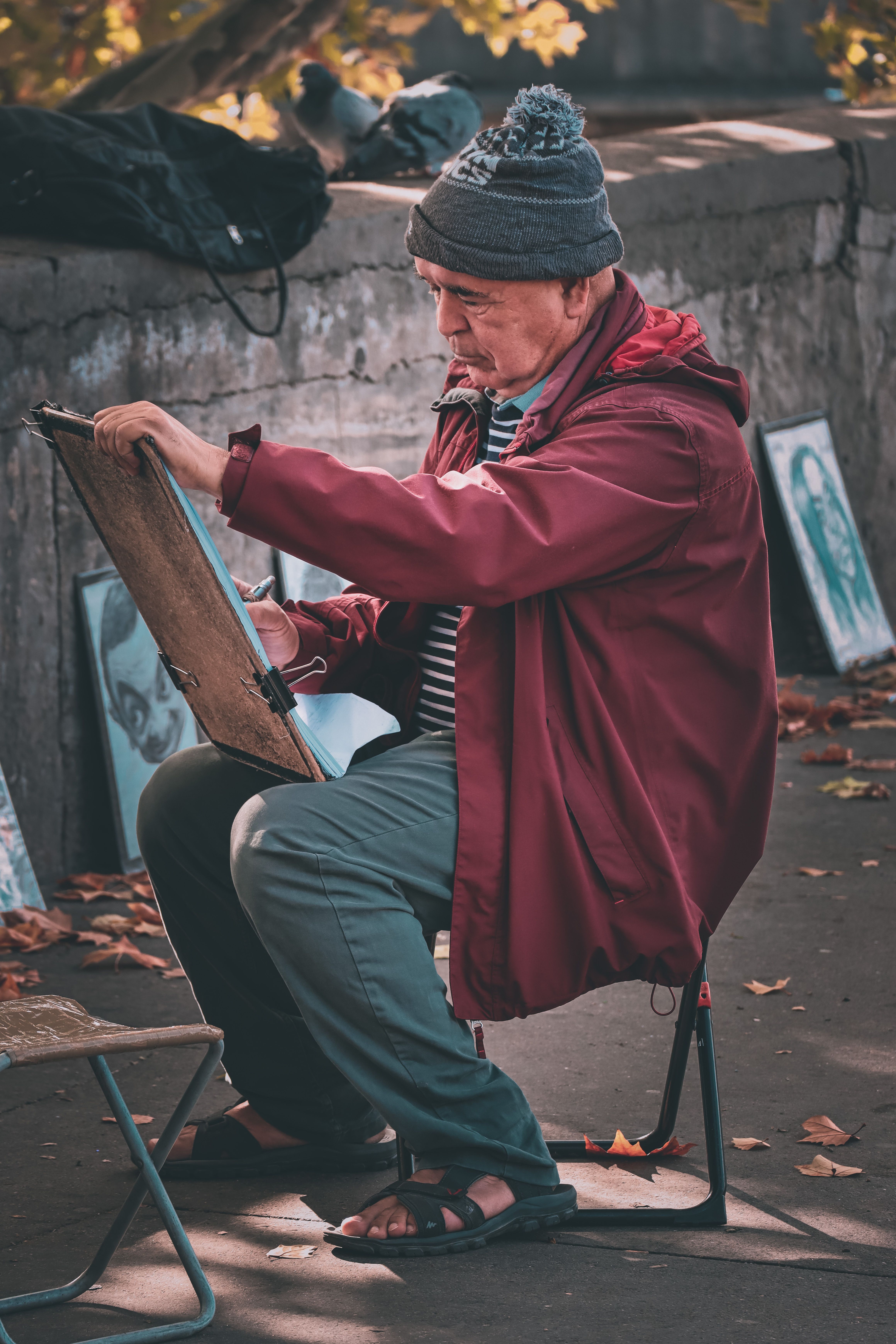 Man Pouring Paint onto his Art Project · Free Stock Photo