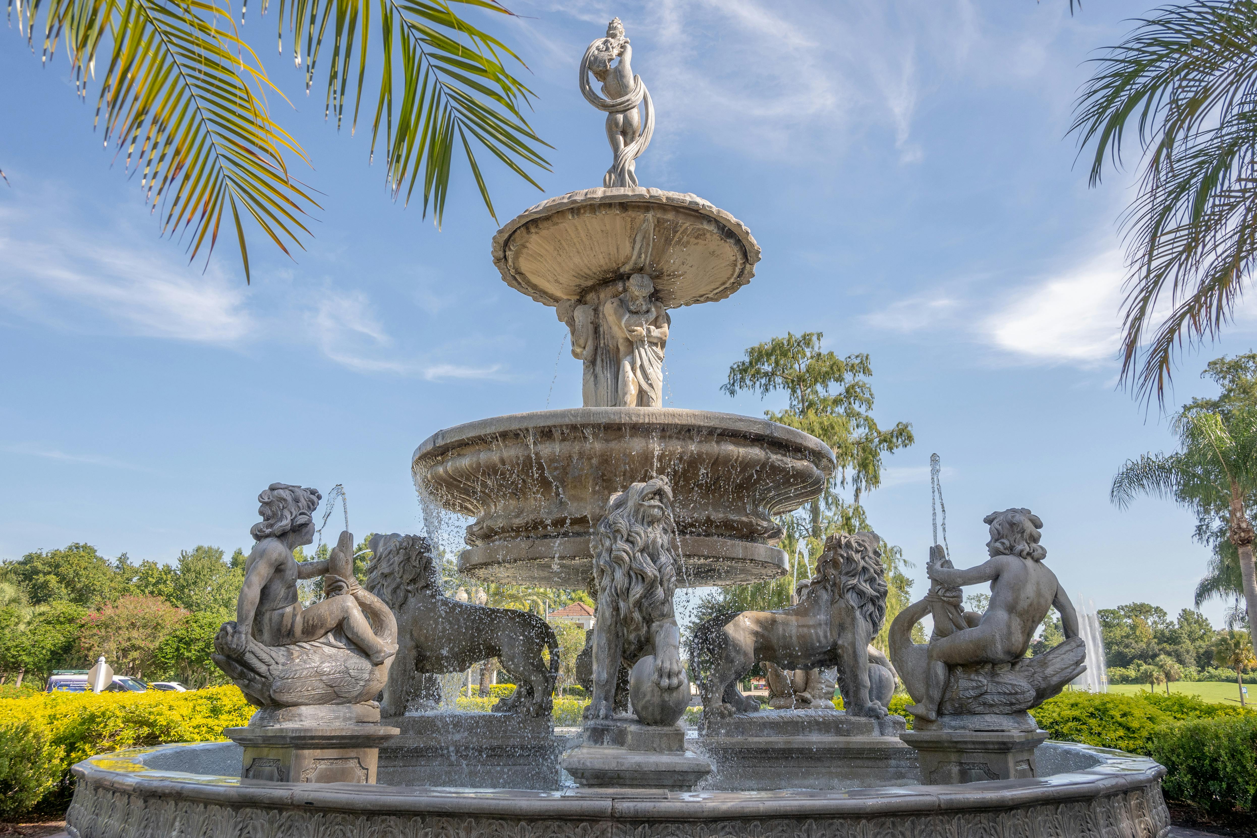 Statues in Front of a Water Fountain · Free Stock Photo