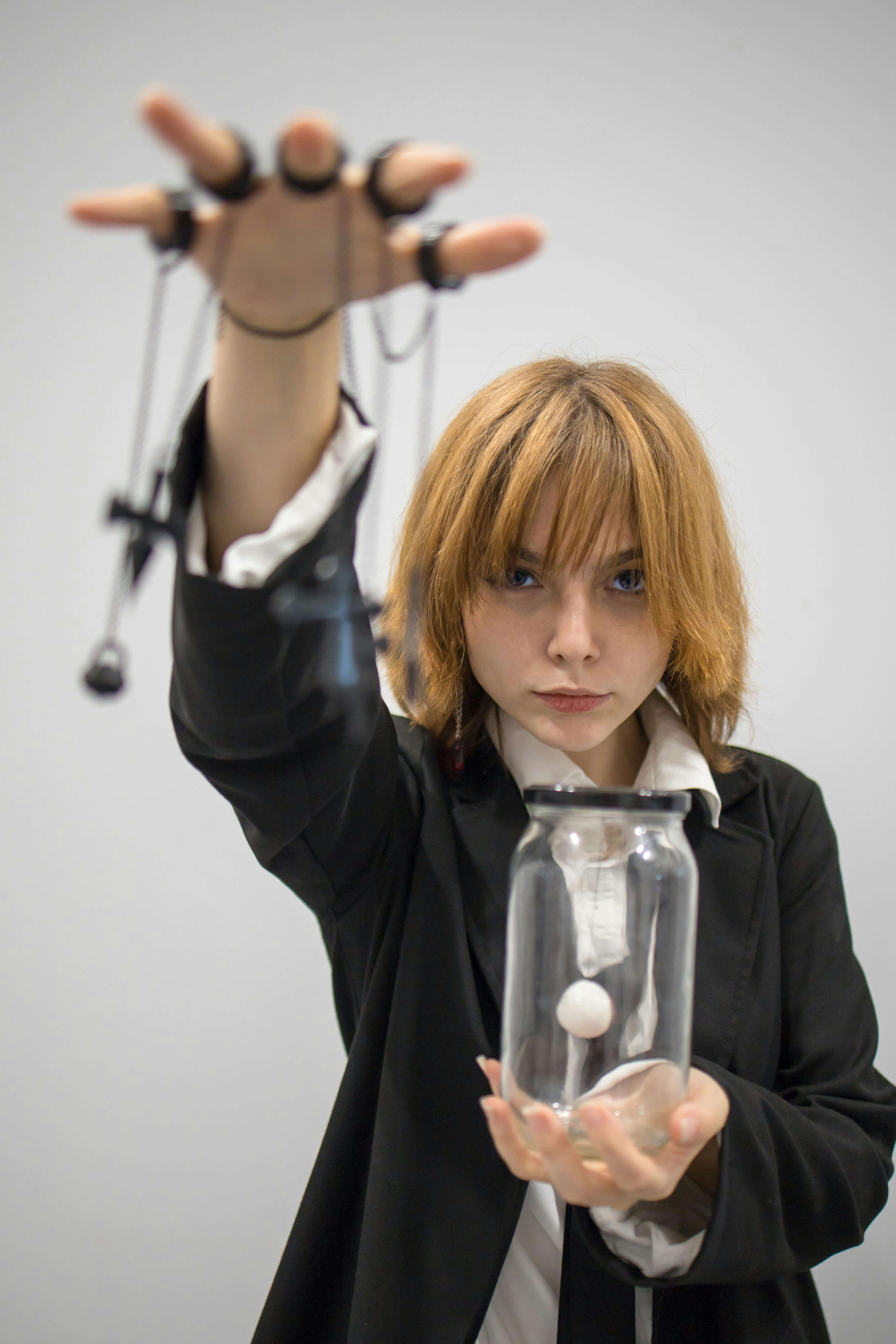 Woman in Cosplay Suit Holding Jar · Free Stock Photo