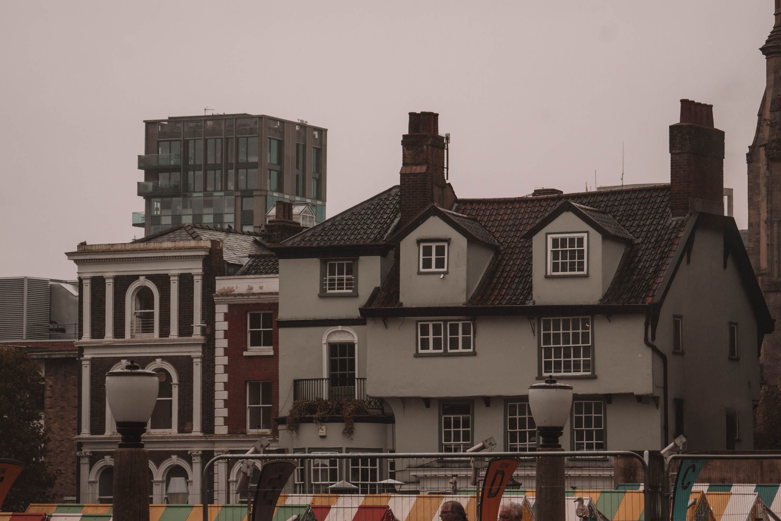 Concrete Buildings Under Gray Sky · Free Stock Photo