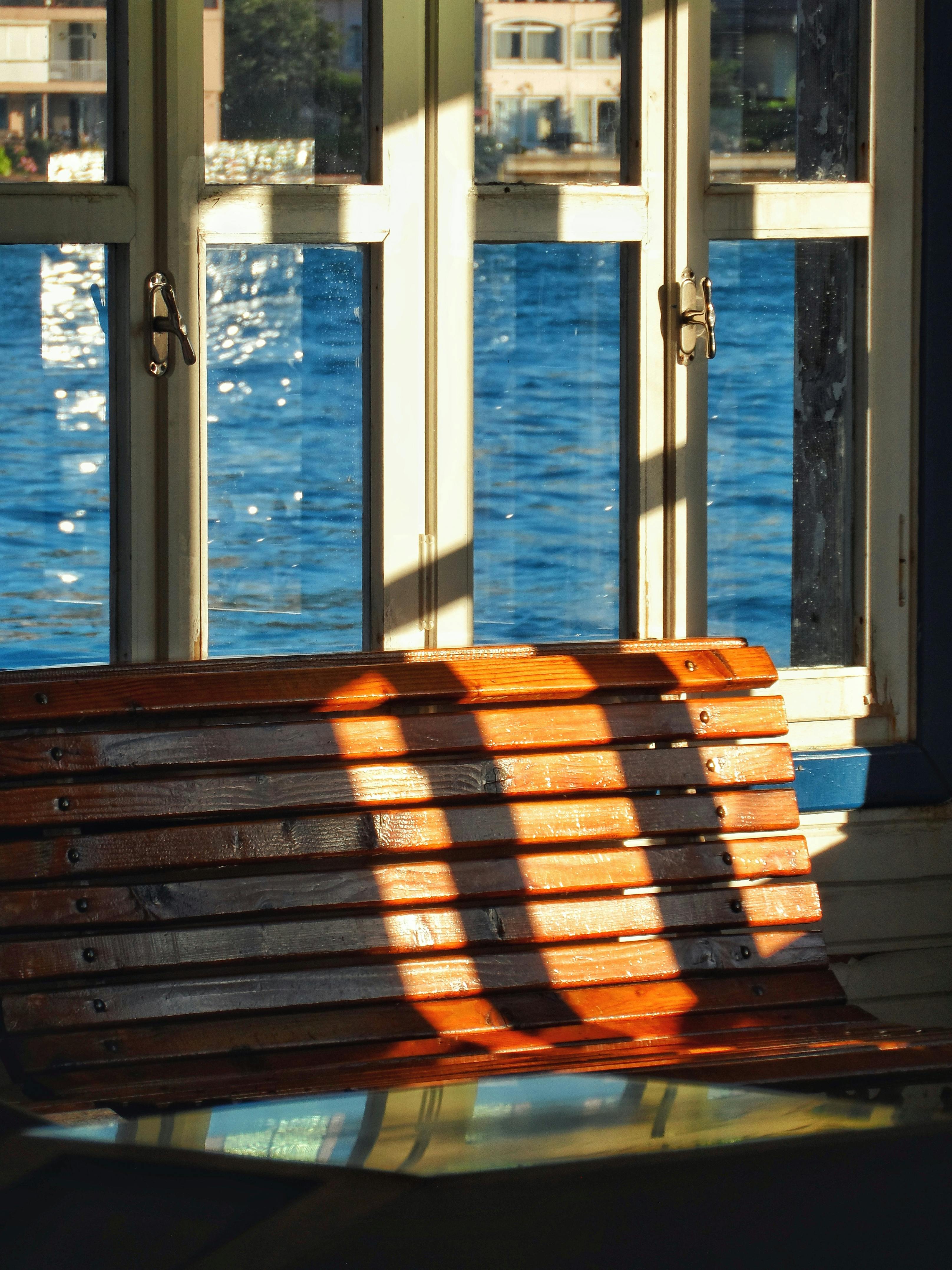 Two Gray Wooden Benches and Black Metal Armless Chair Beside Wall ...