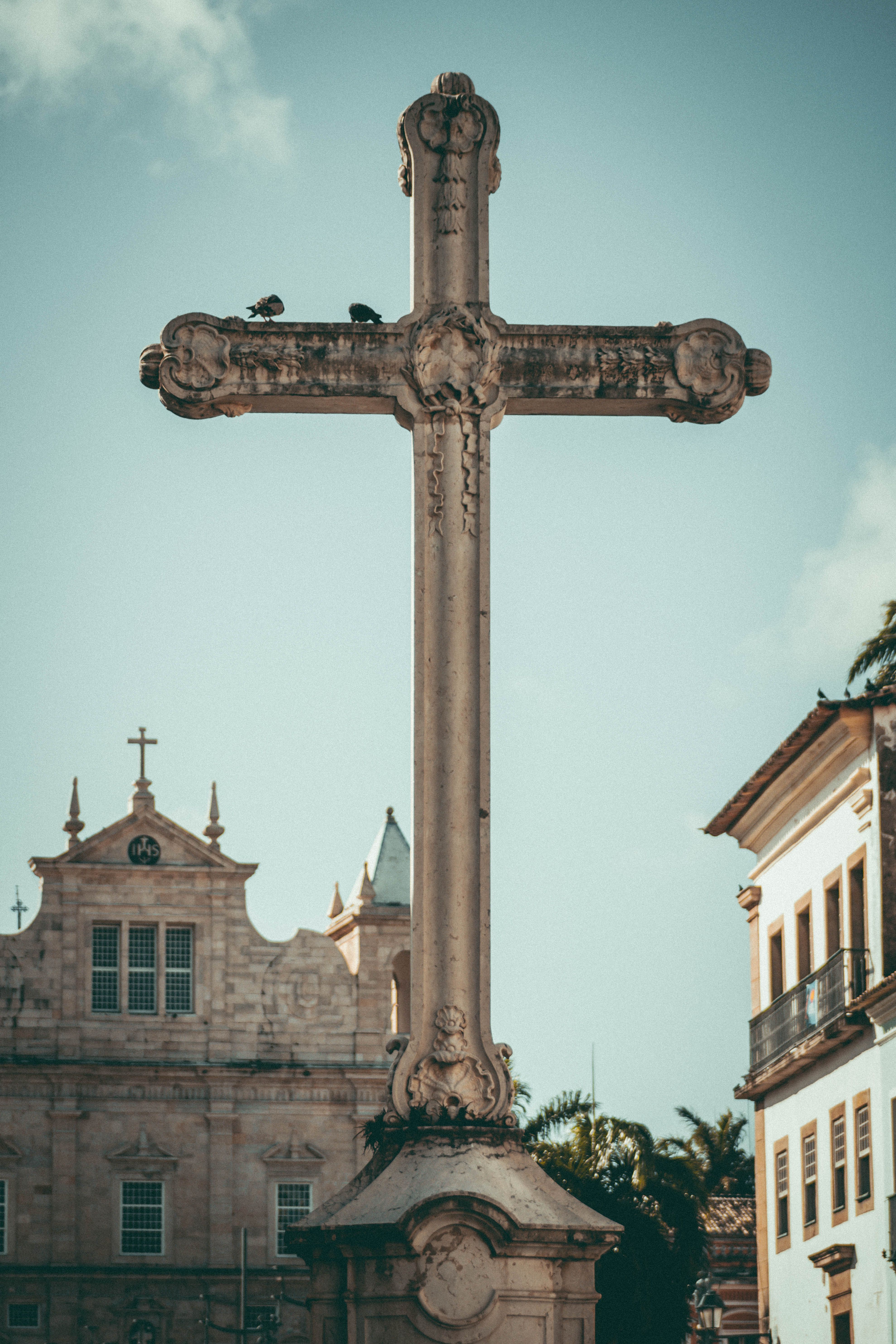 Concrete Cross Near a Church Building · Free Stock Photo