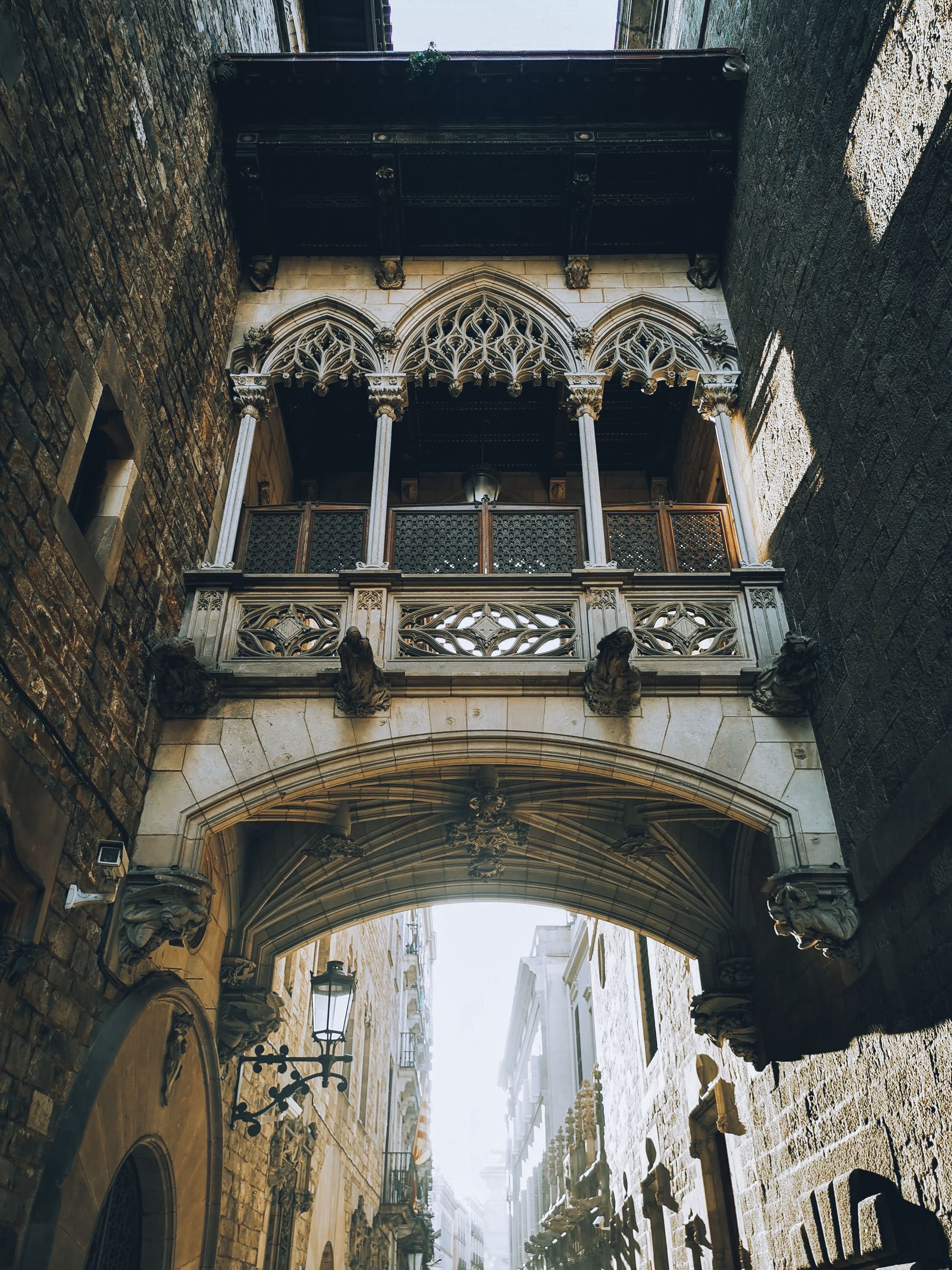 Bridge in Between Brick Building · Free Stock Photo