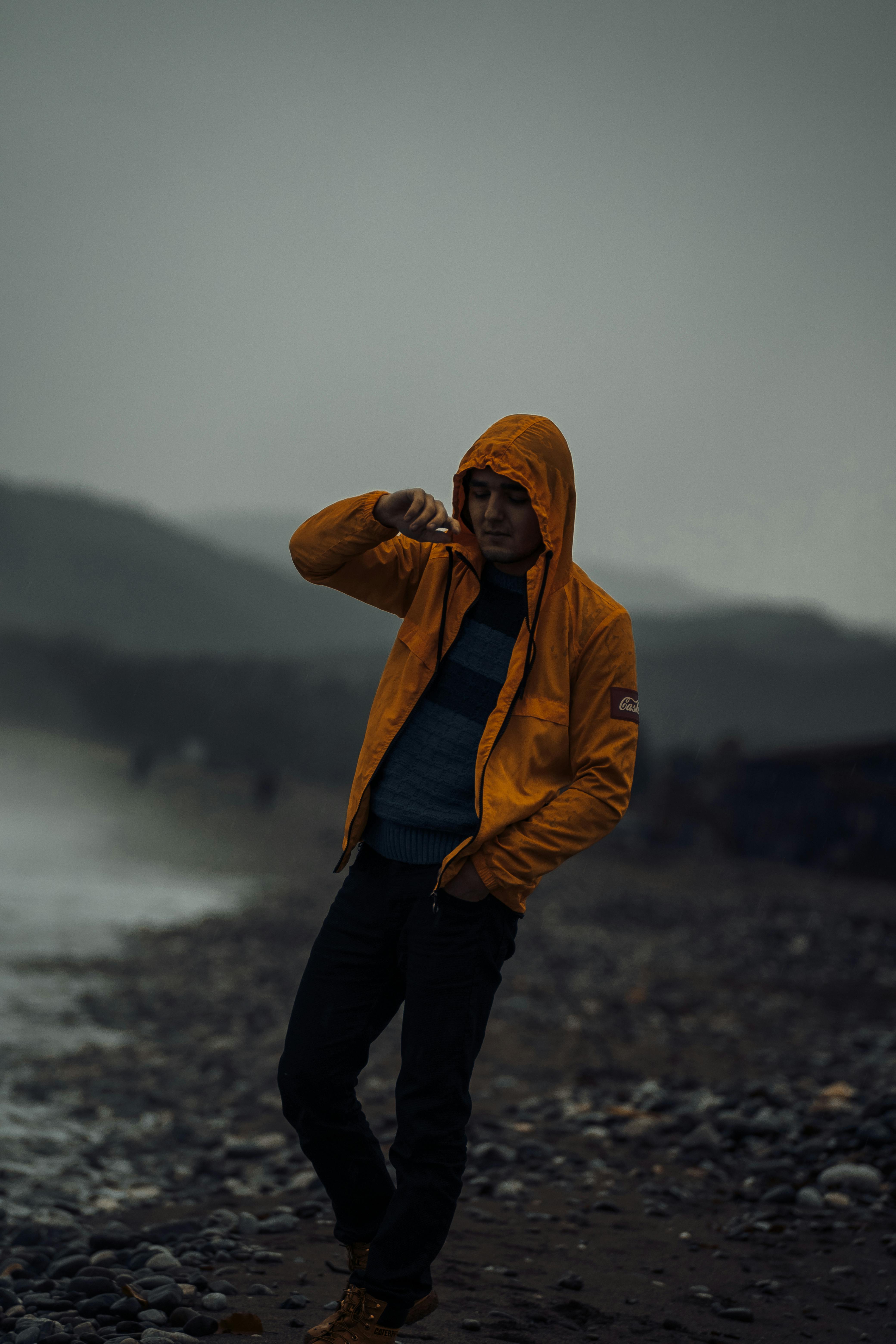Man in Yellow Jacket at the Beach · Free Stock Photo
