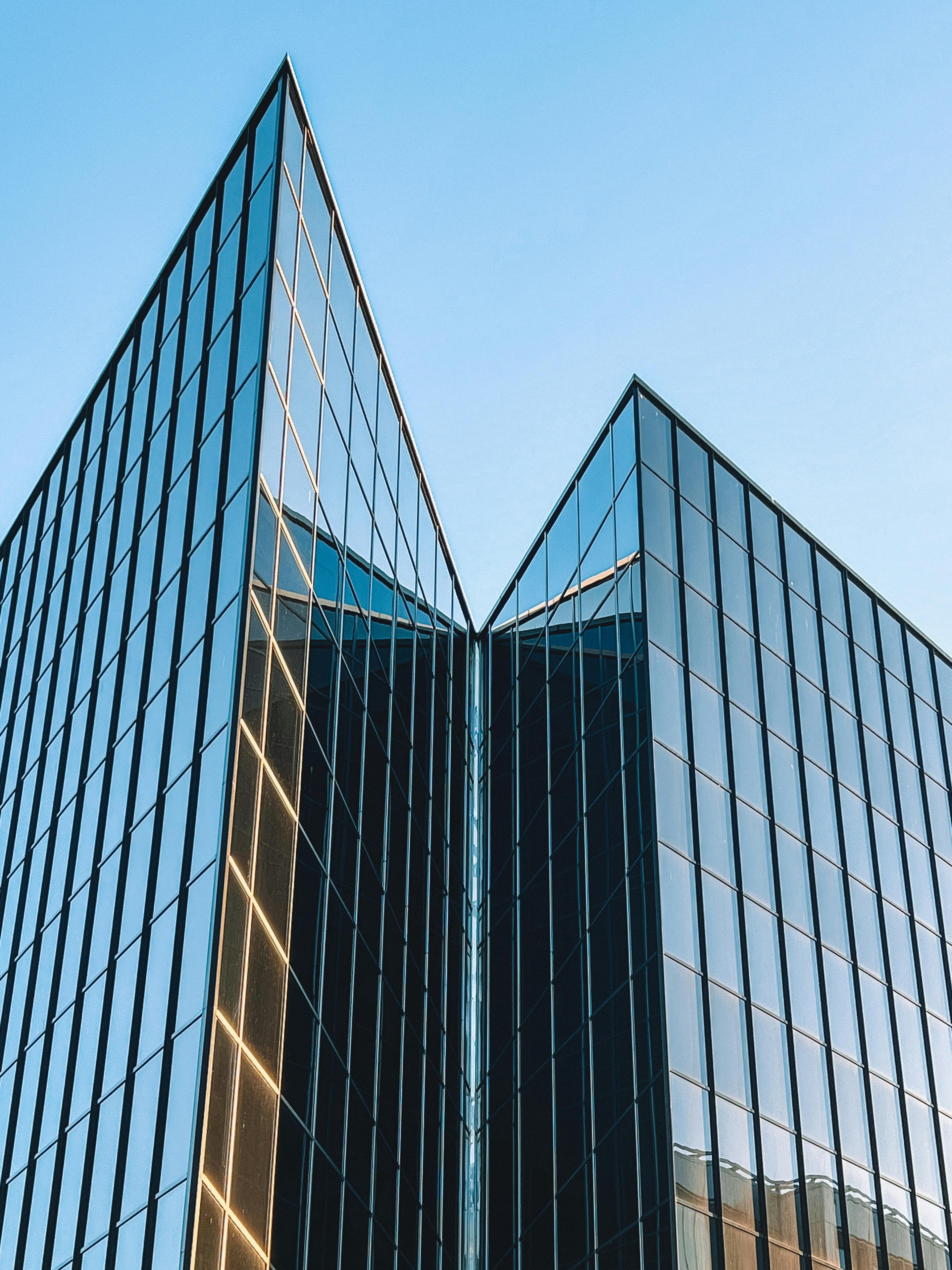 Glass Windows Exterior of a High Rise Building · Free Stock Photo