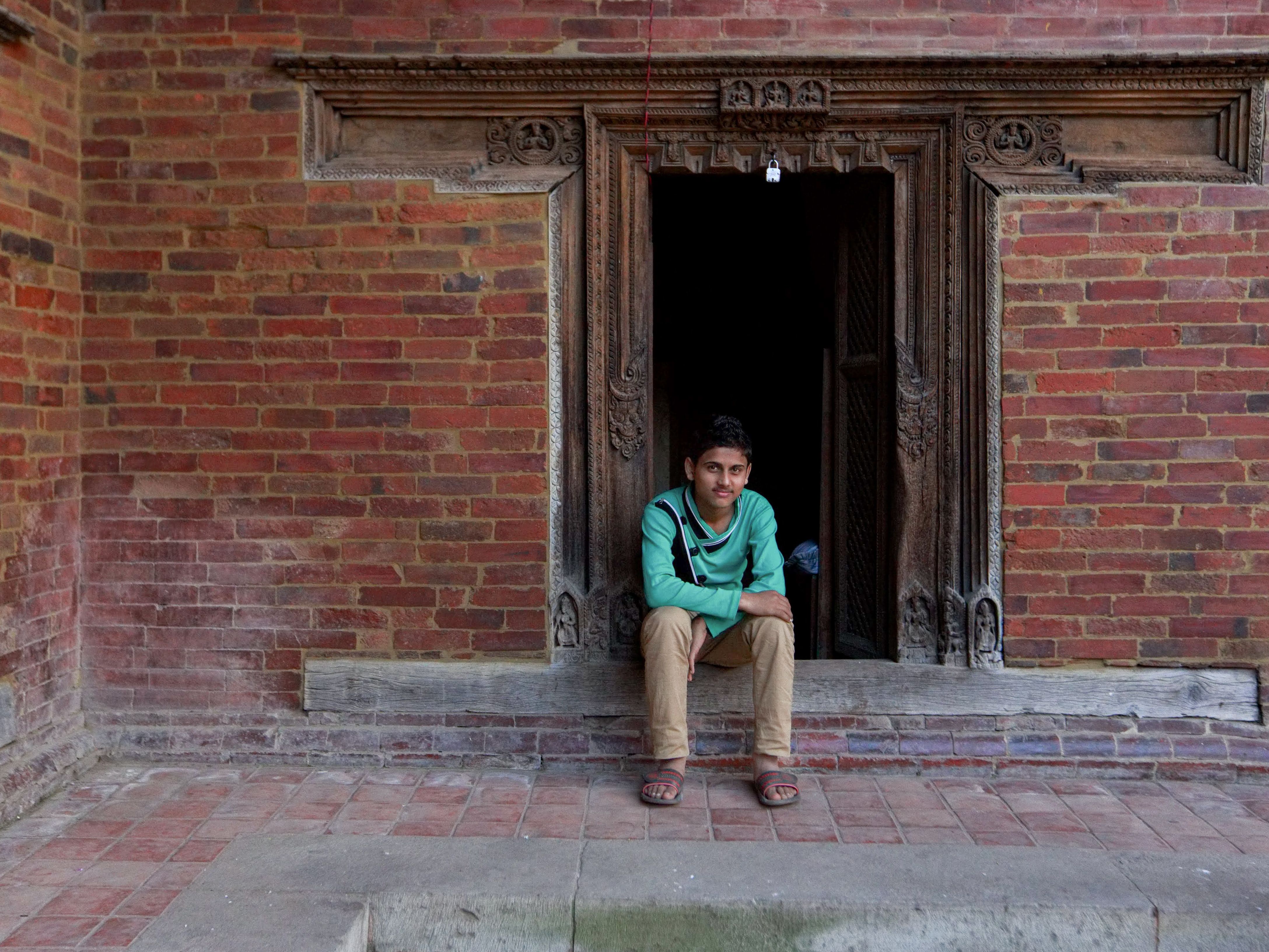 Man Sitting at the Doorstep · Free Stock Photo