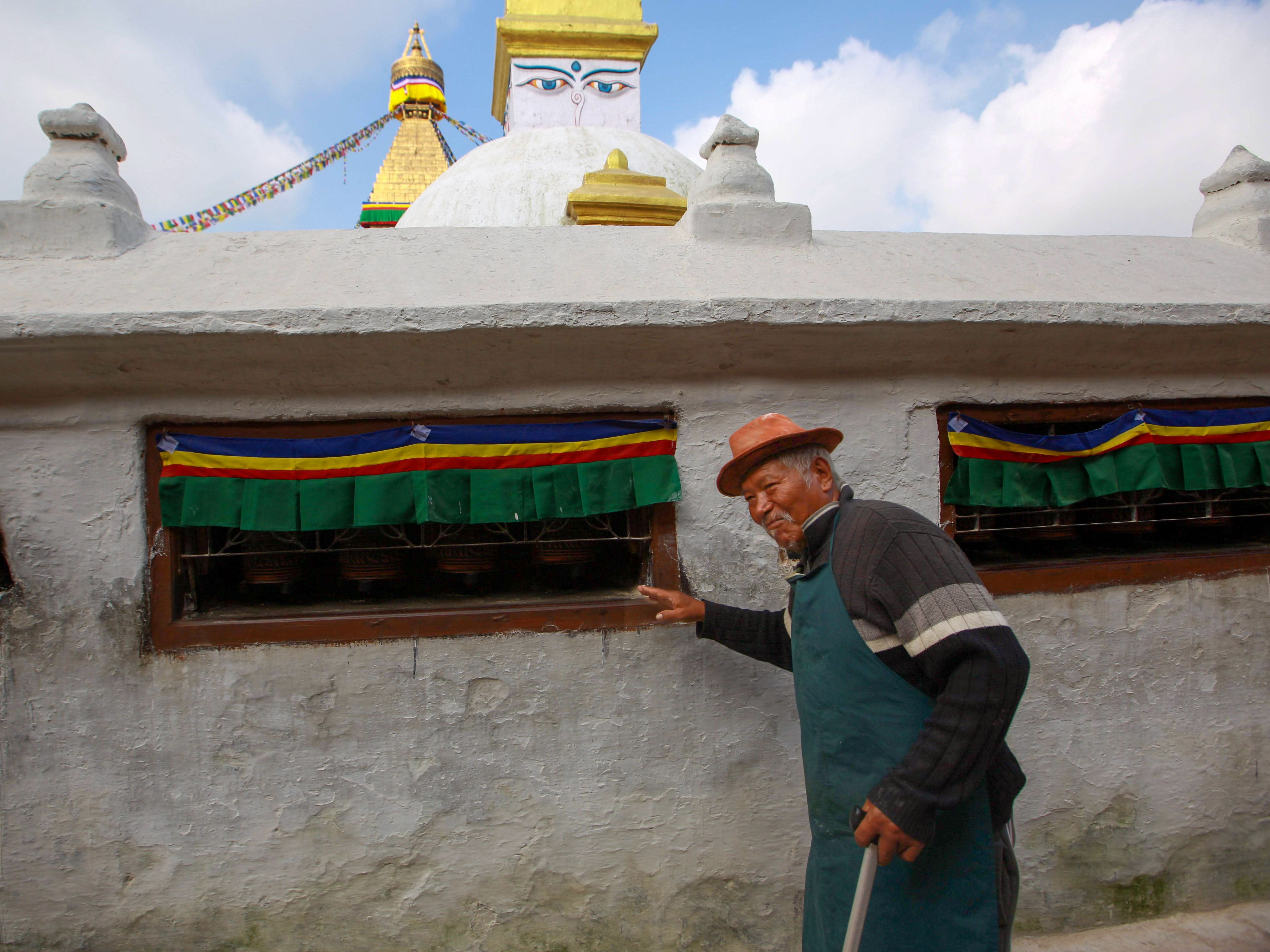 Elderly Man by Buddhist Temple · Free Stock Photo