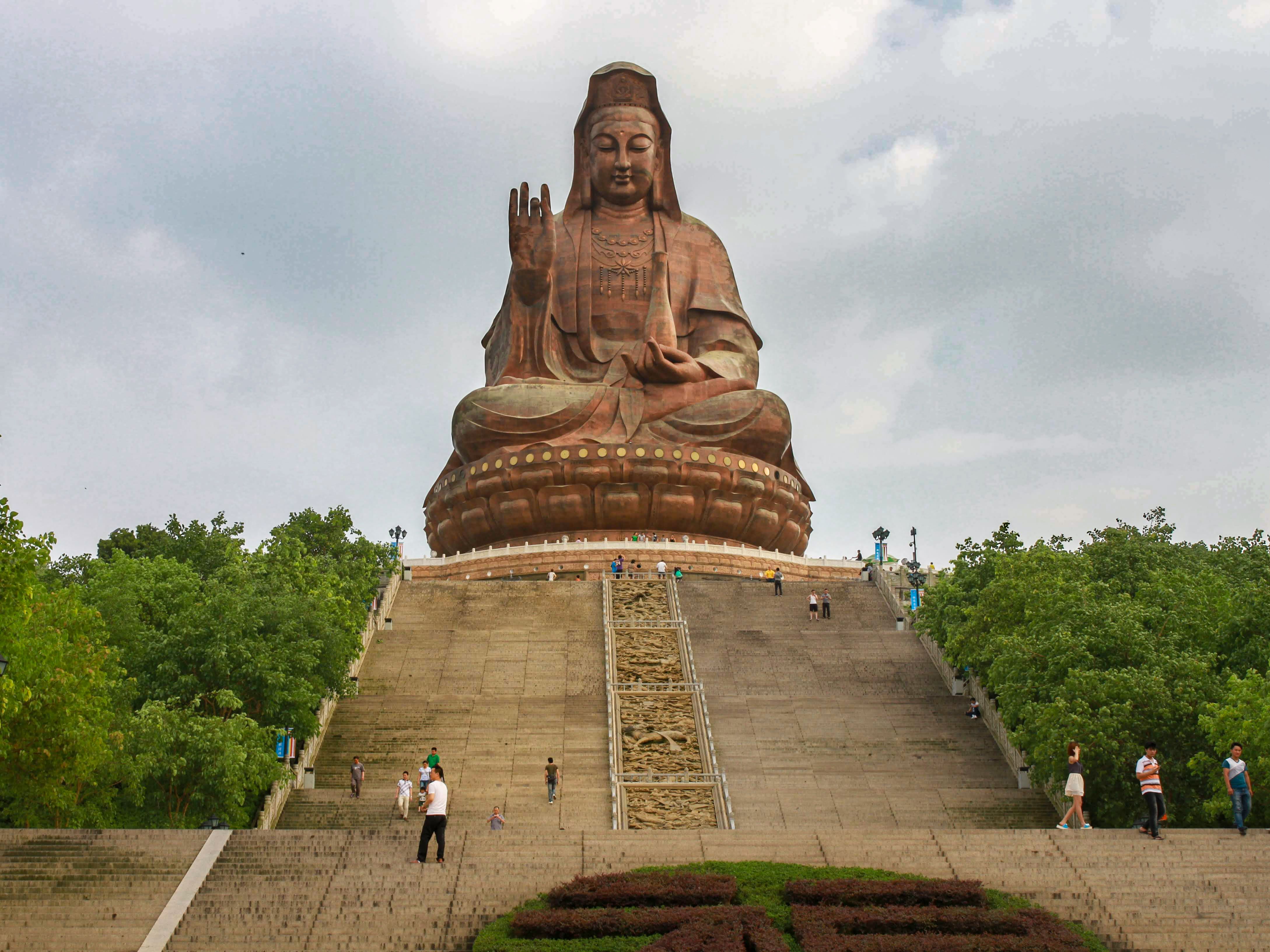 Brown Concrete Statue Under White Sky · Free Stock Photo