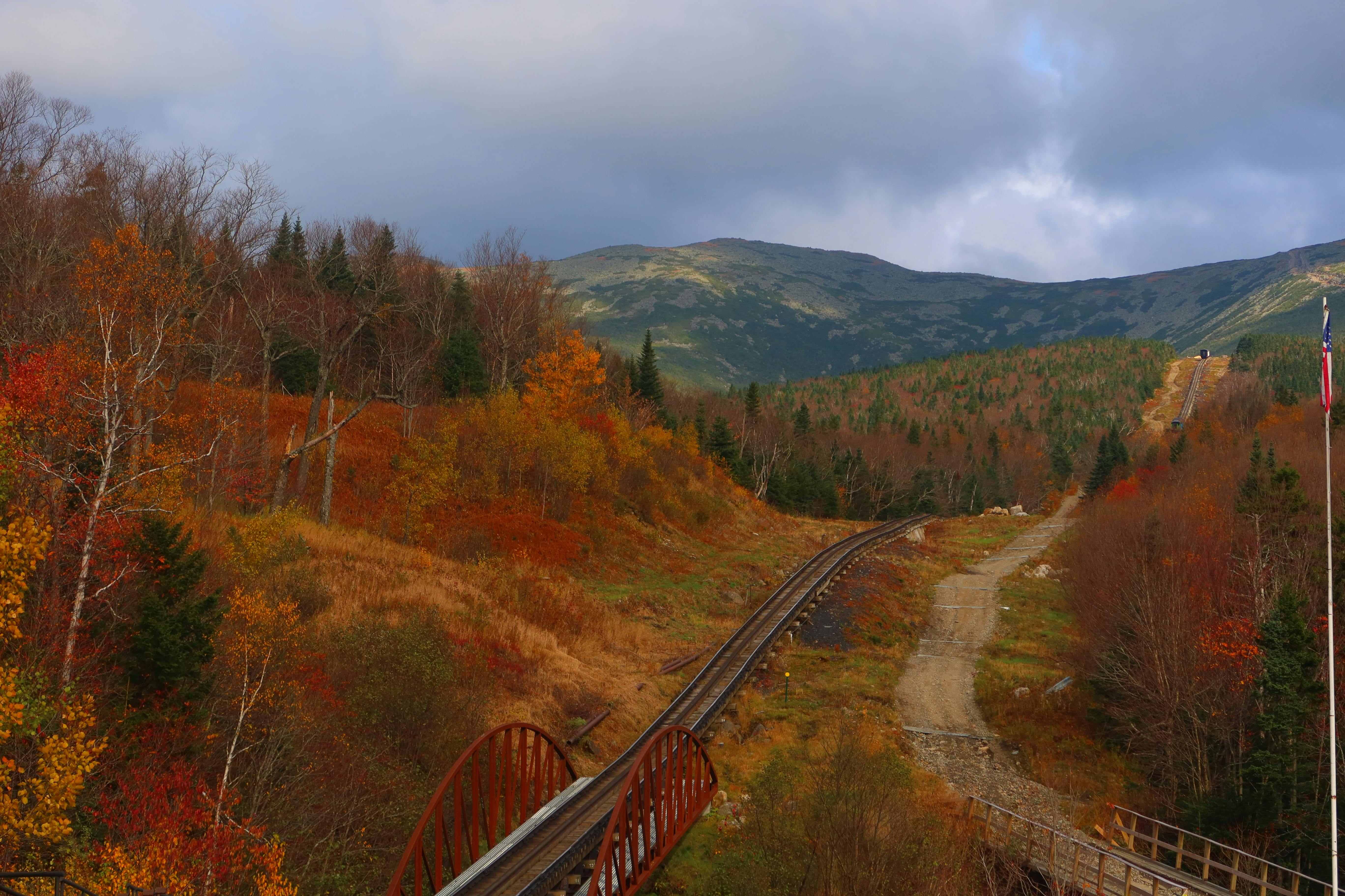 Railway on the Hillside Under Cloudy Sky · Free Stock Photo