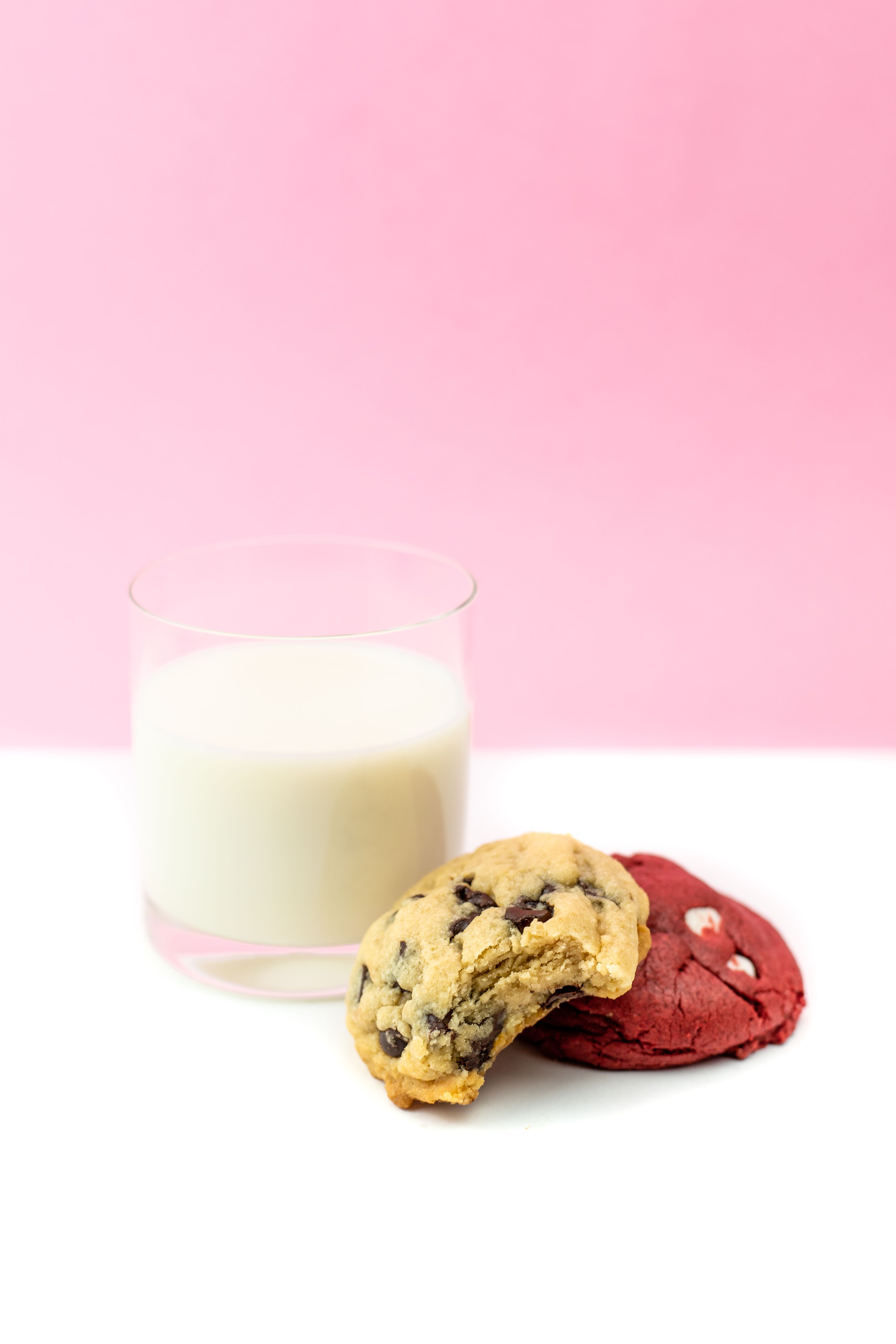 Person Dipping Cookie in Milk · Free Stock Photo