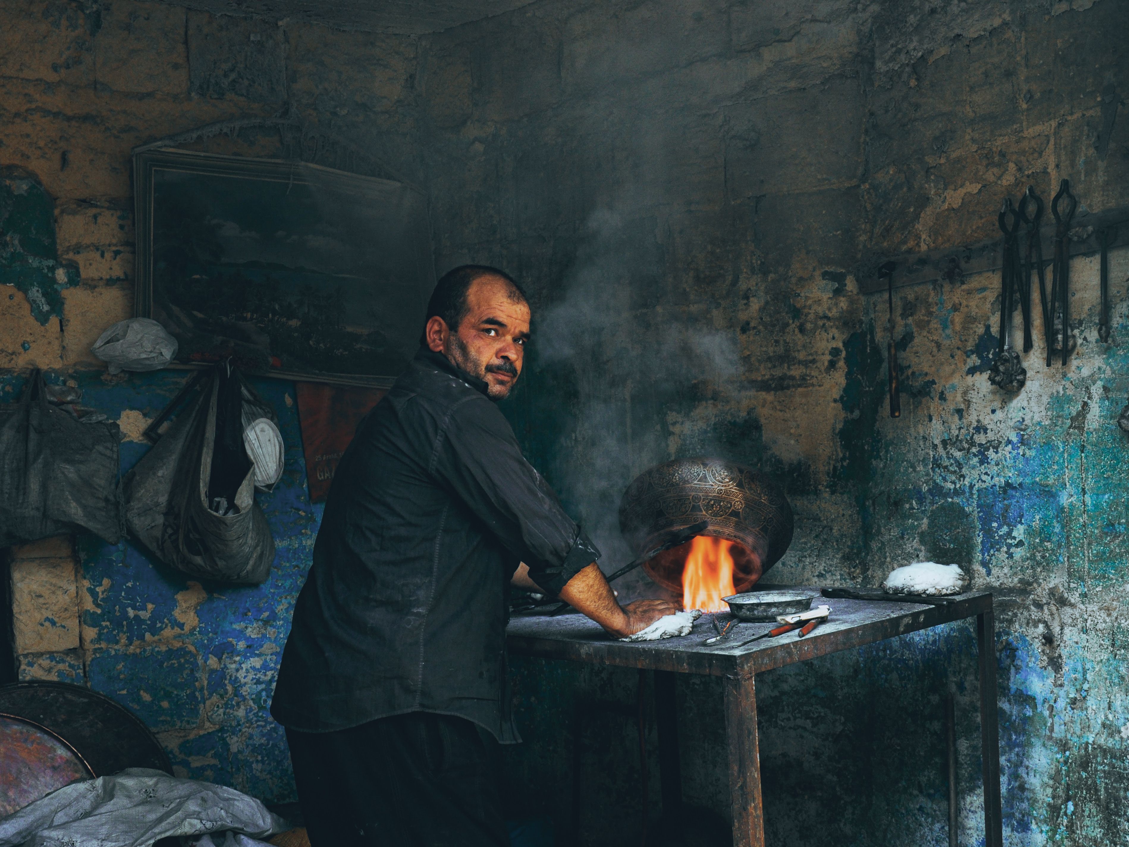 Man Doing Metalwork in a Workshop · Free Stock Photo