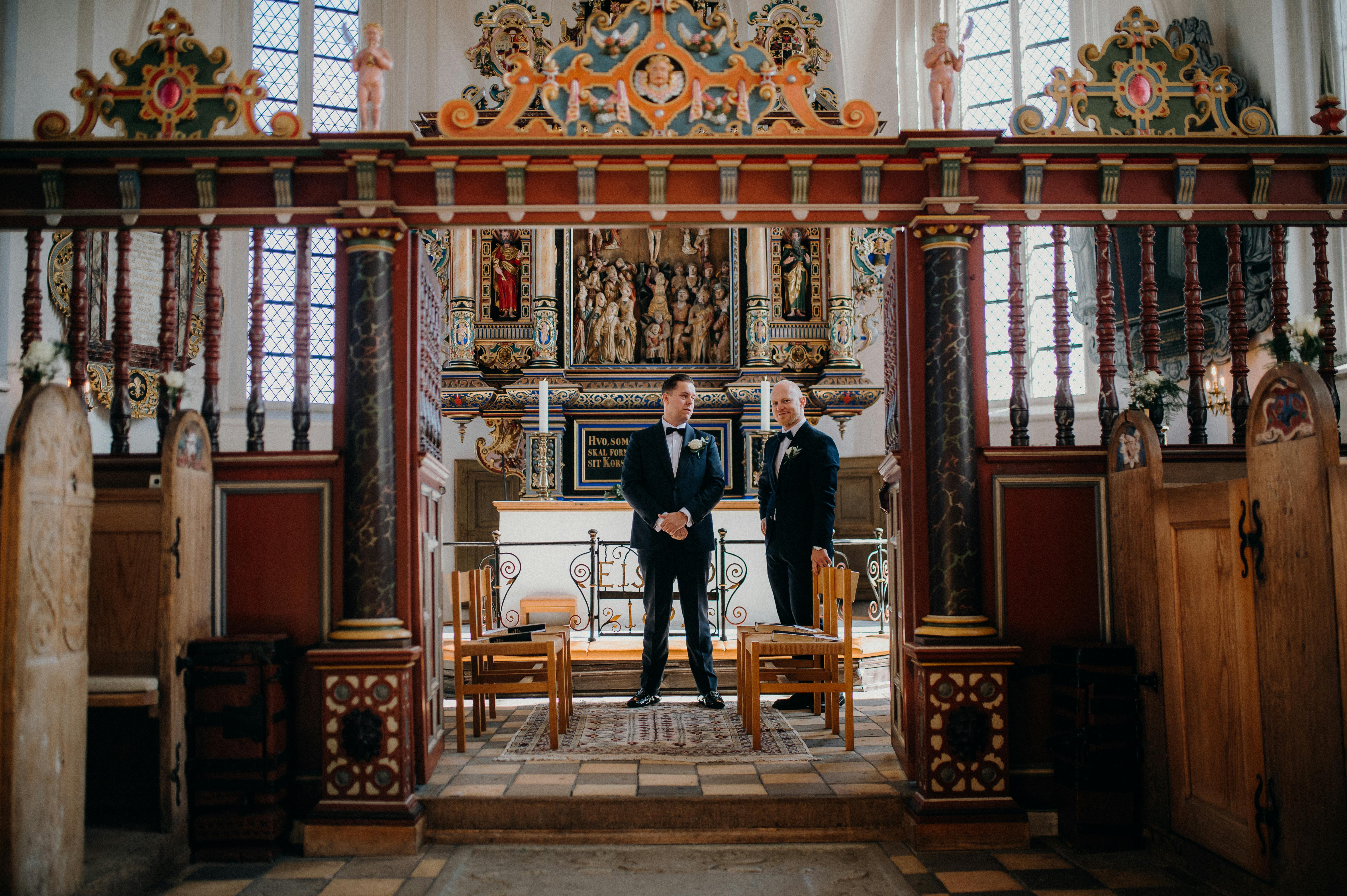 Men Standing in front of the Altar · Free Stock Photo