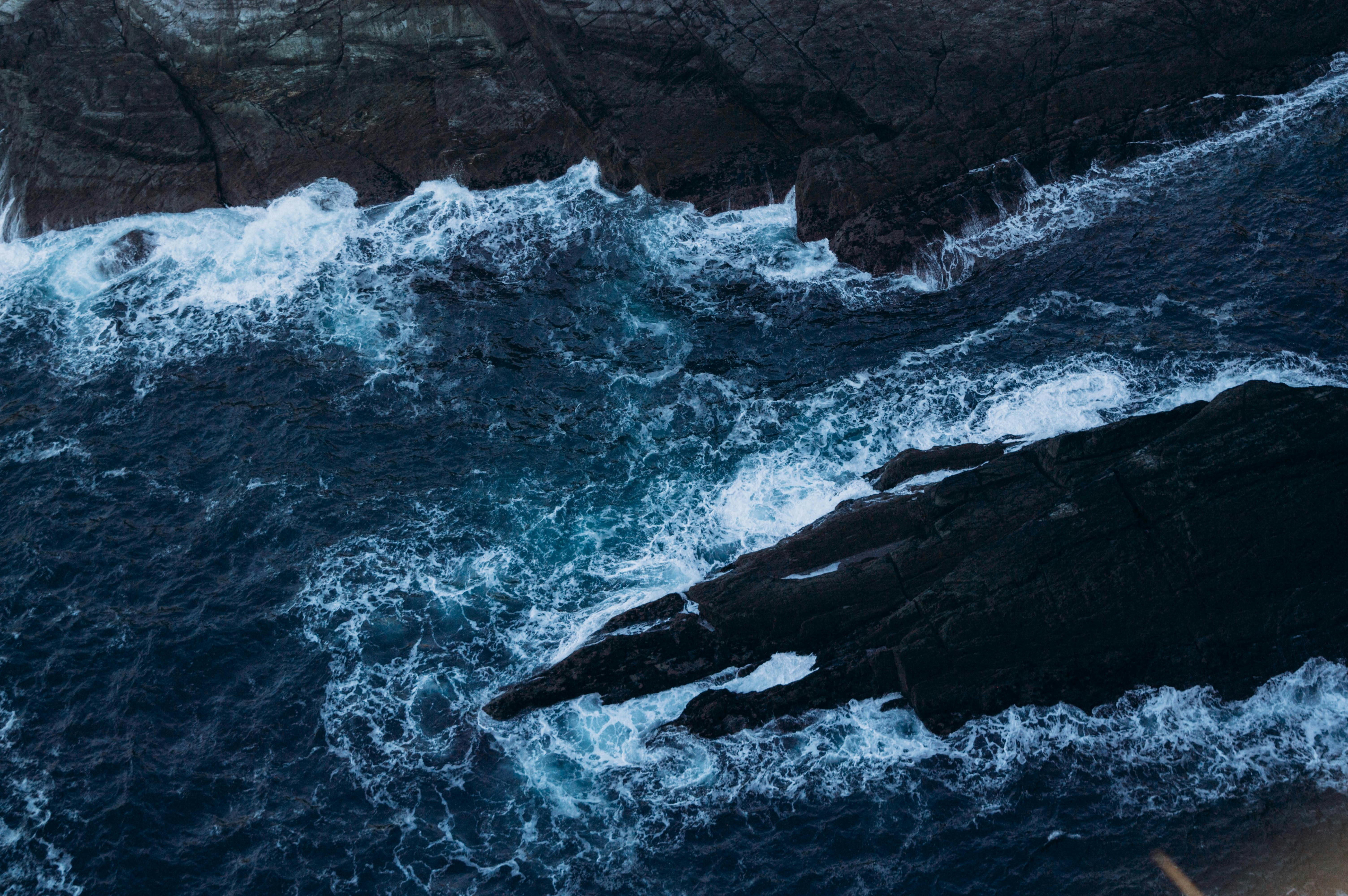 Seashore Wave Crashing on Rock Formation · Free Stock Photo