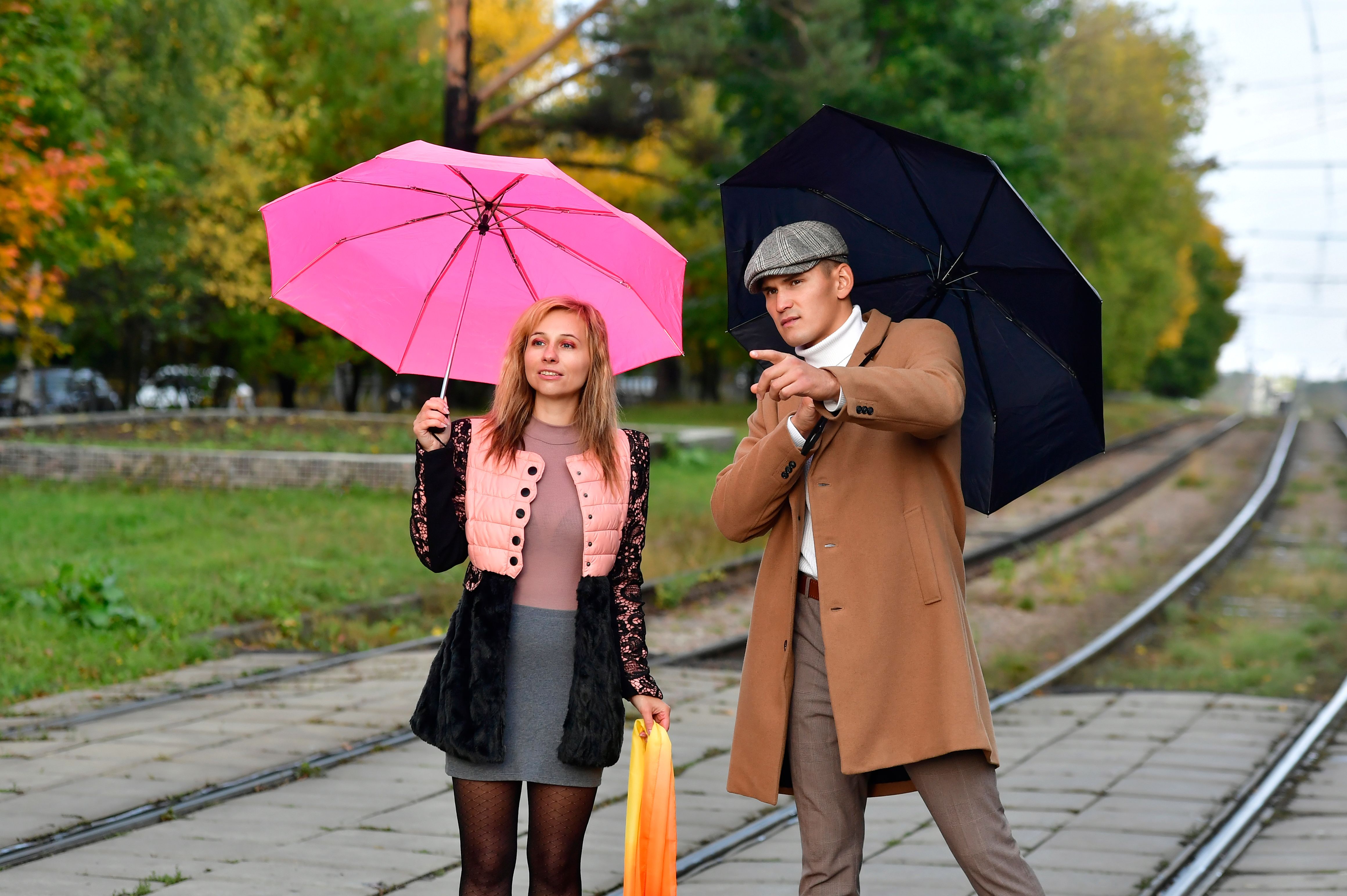 Man Showing Direction to a Woman · Free Stock Photo