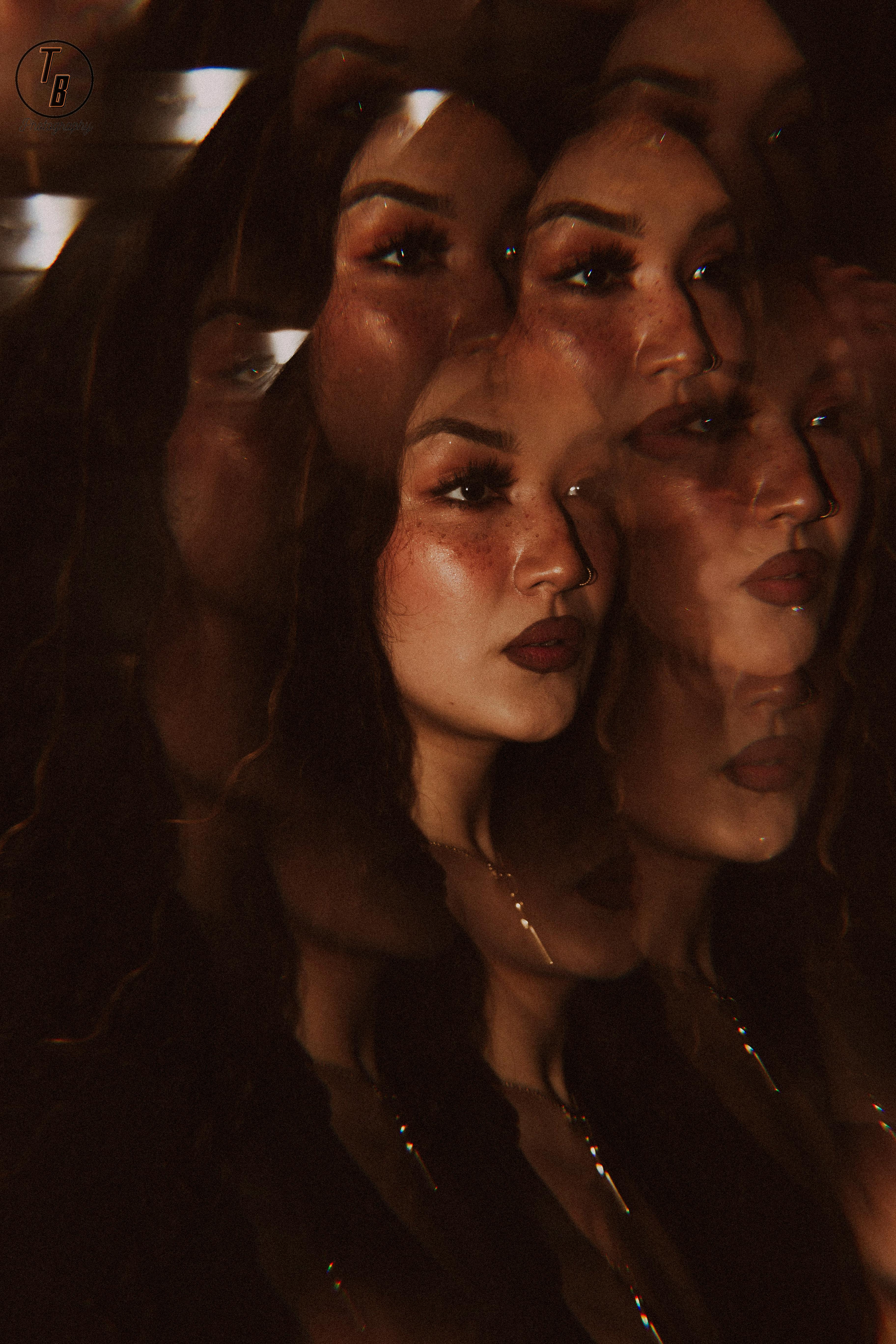 Multiplied Reflection of a Womans Face · Free Stock Photo