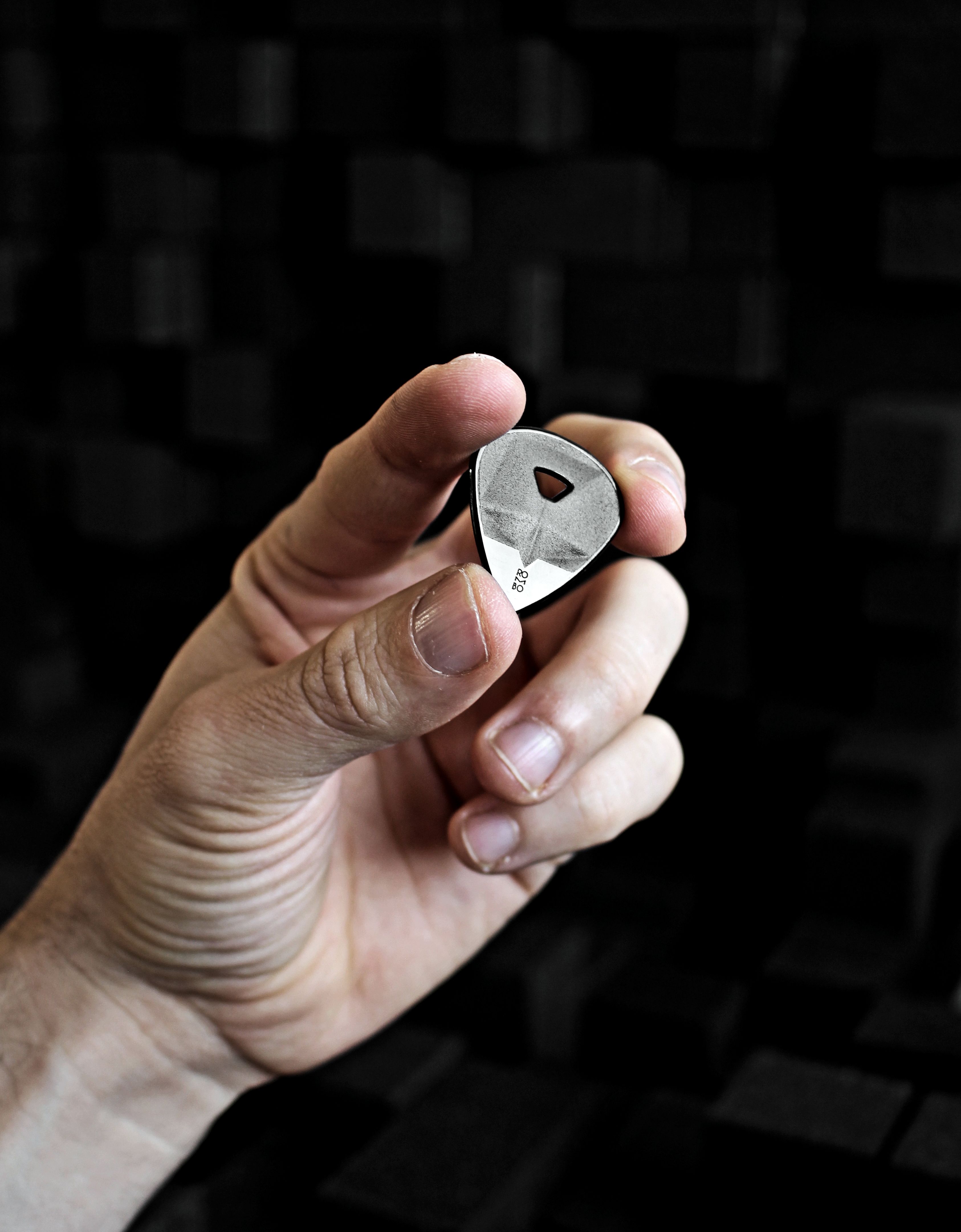 A Hand Holding Guitar Picks · Free Stock Photo