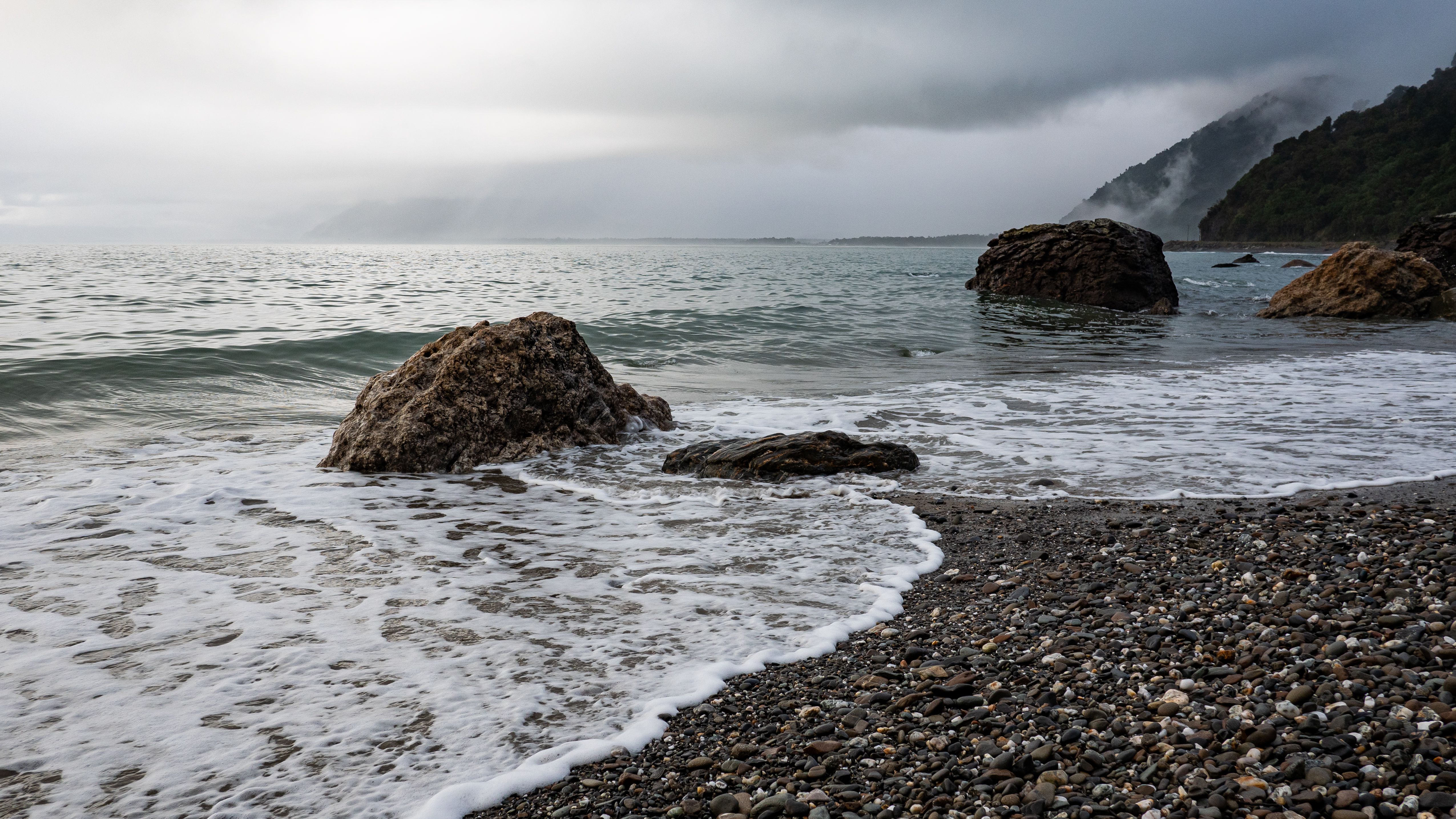 Rocks on Sand Beach in Sea on Sunset · Free Stock Photo