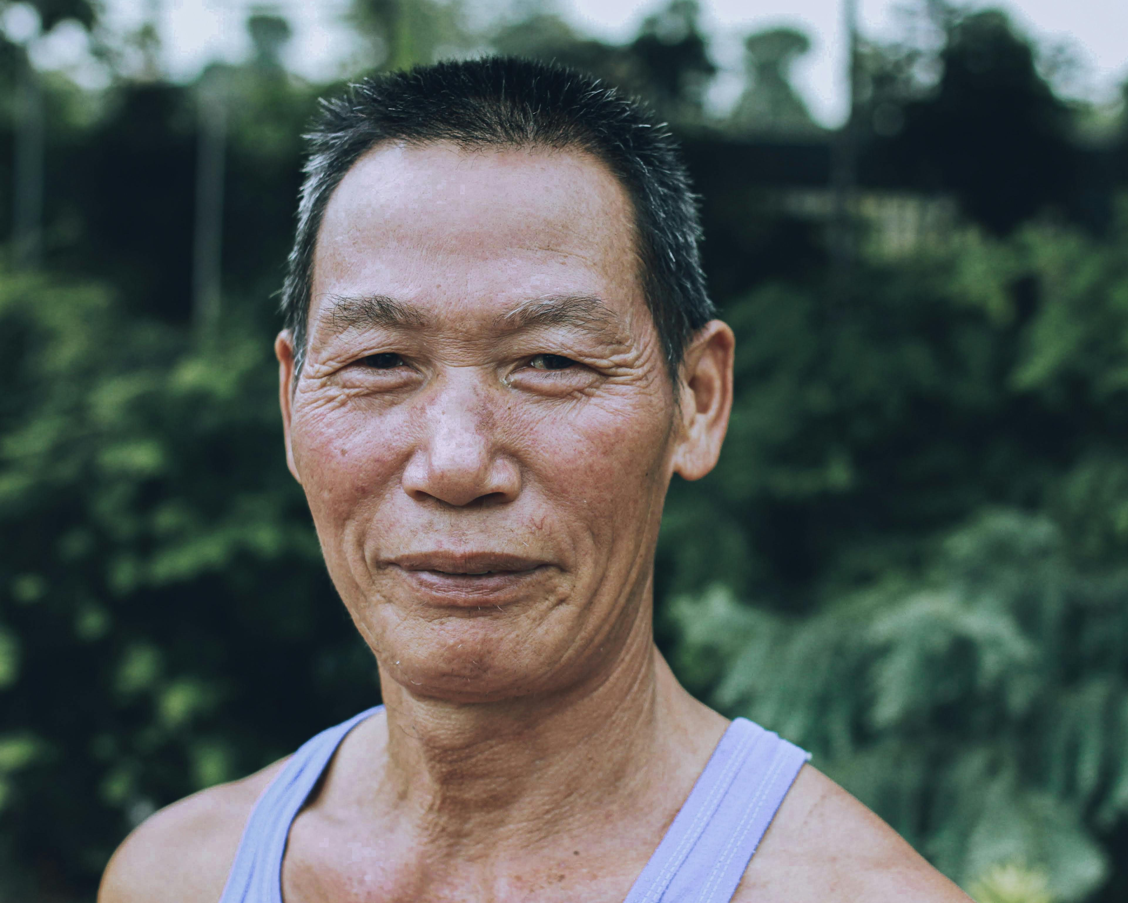 Man in Blue Top Picking Nose · Free Stock Photo