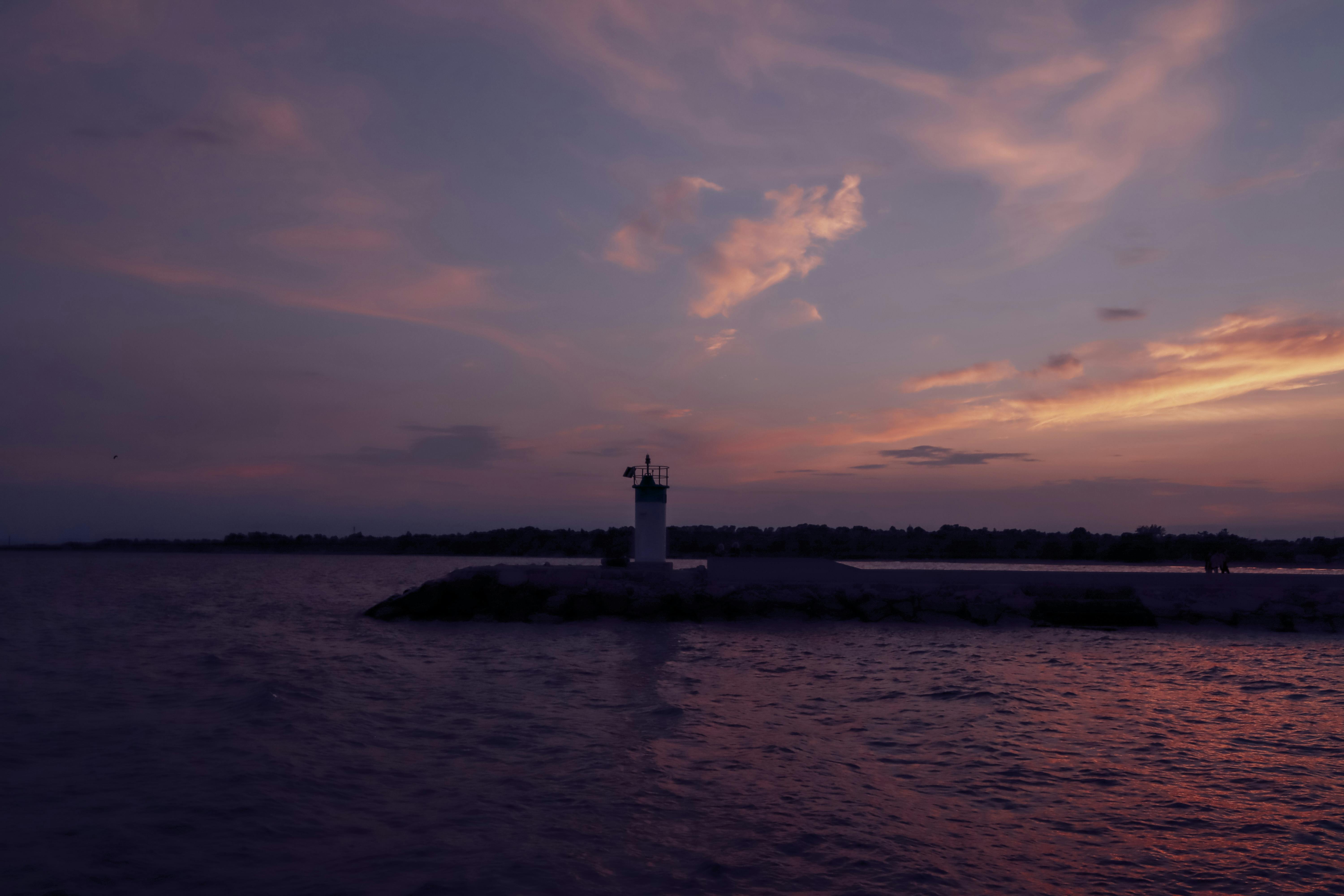 Lighthouse Tower Under Purple Sky · Free Stock Photo