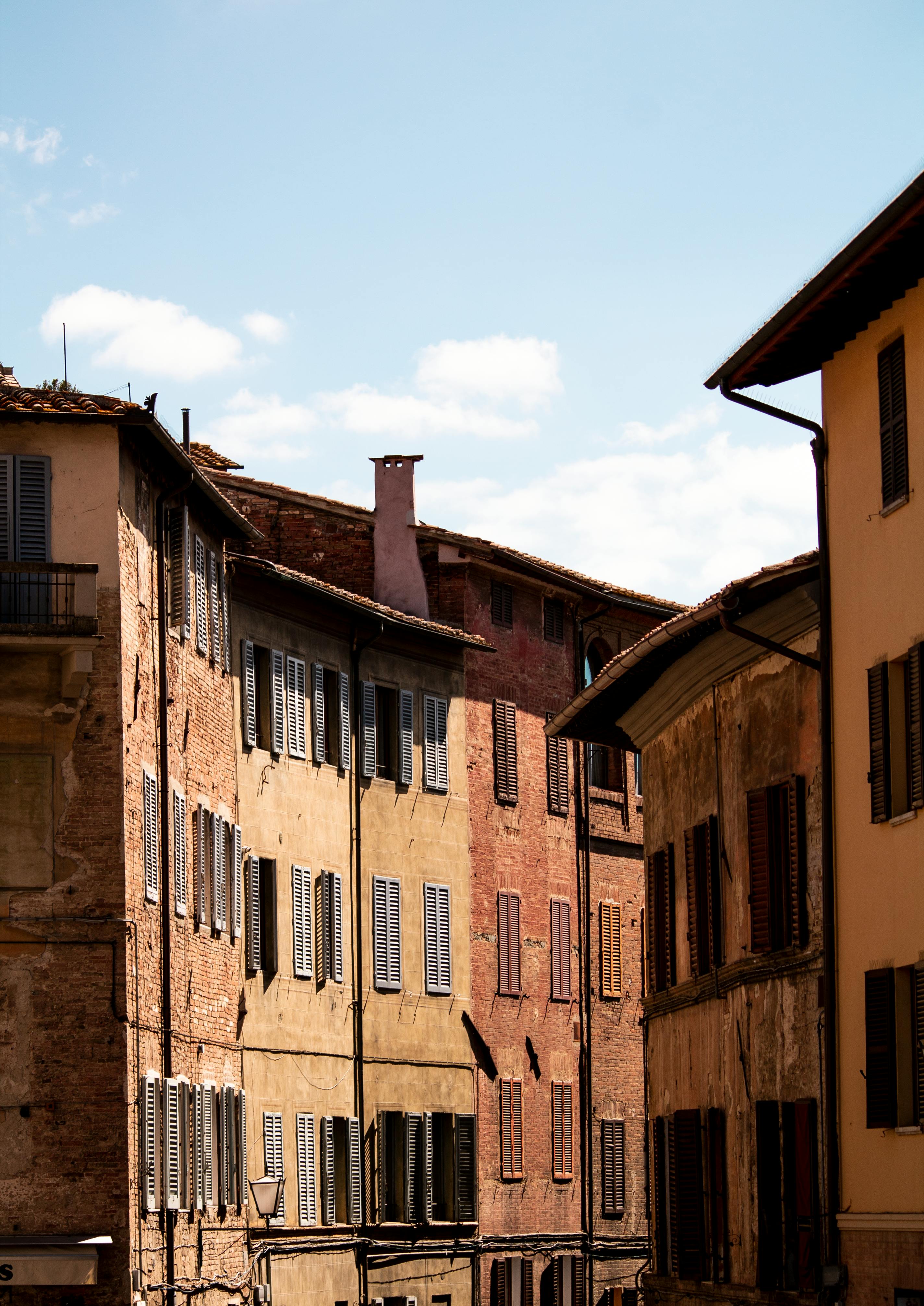 Brown Concrete Buildings · Free Stock Photo