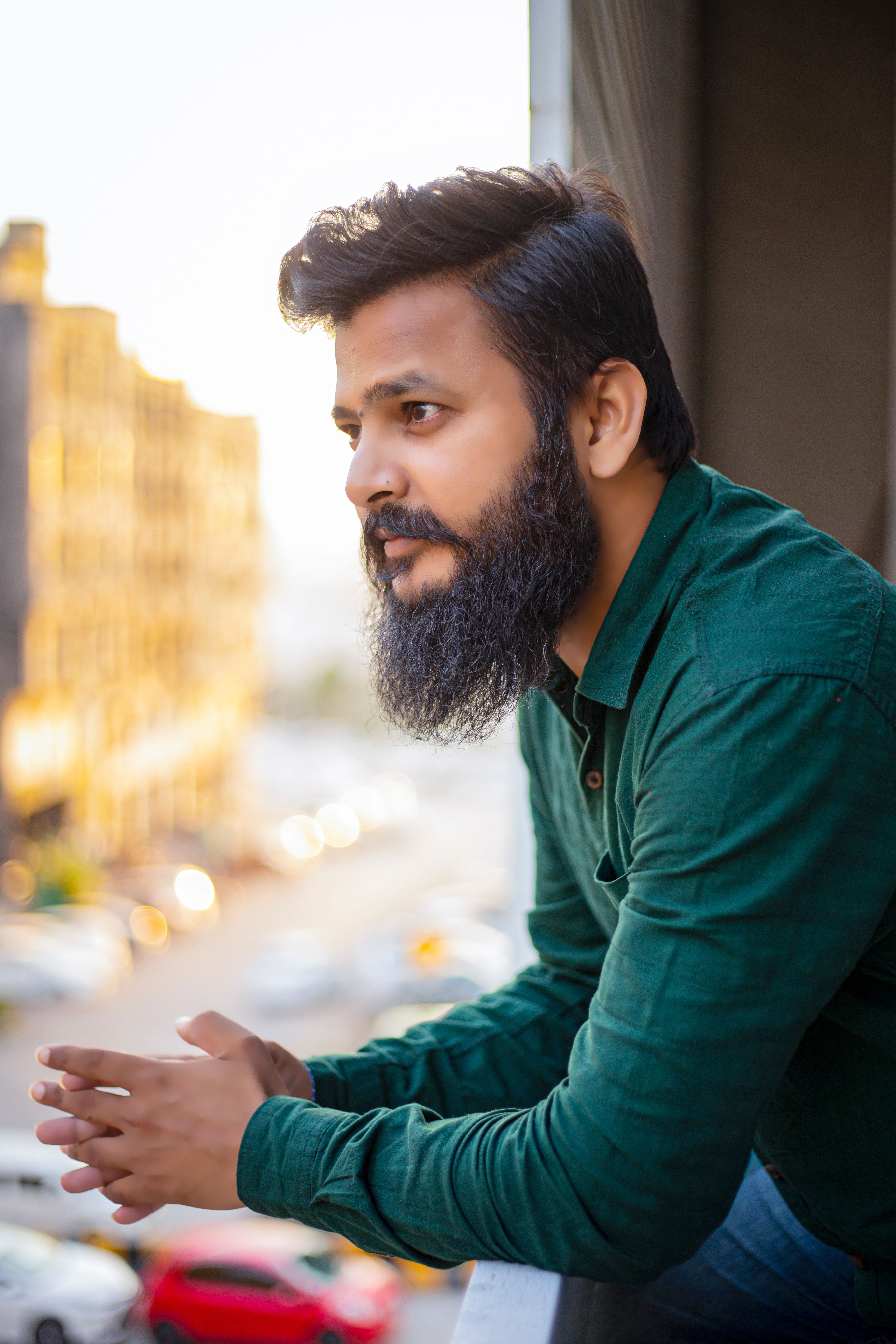 A Bearded Man Wearing Green Long Sleeves · Free Stock Photo