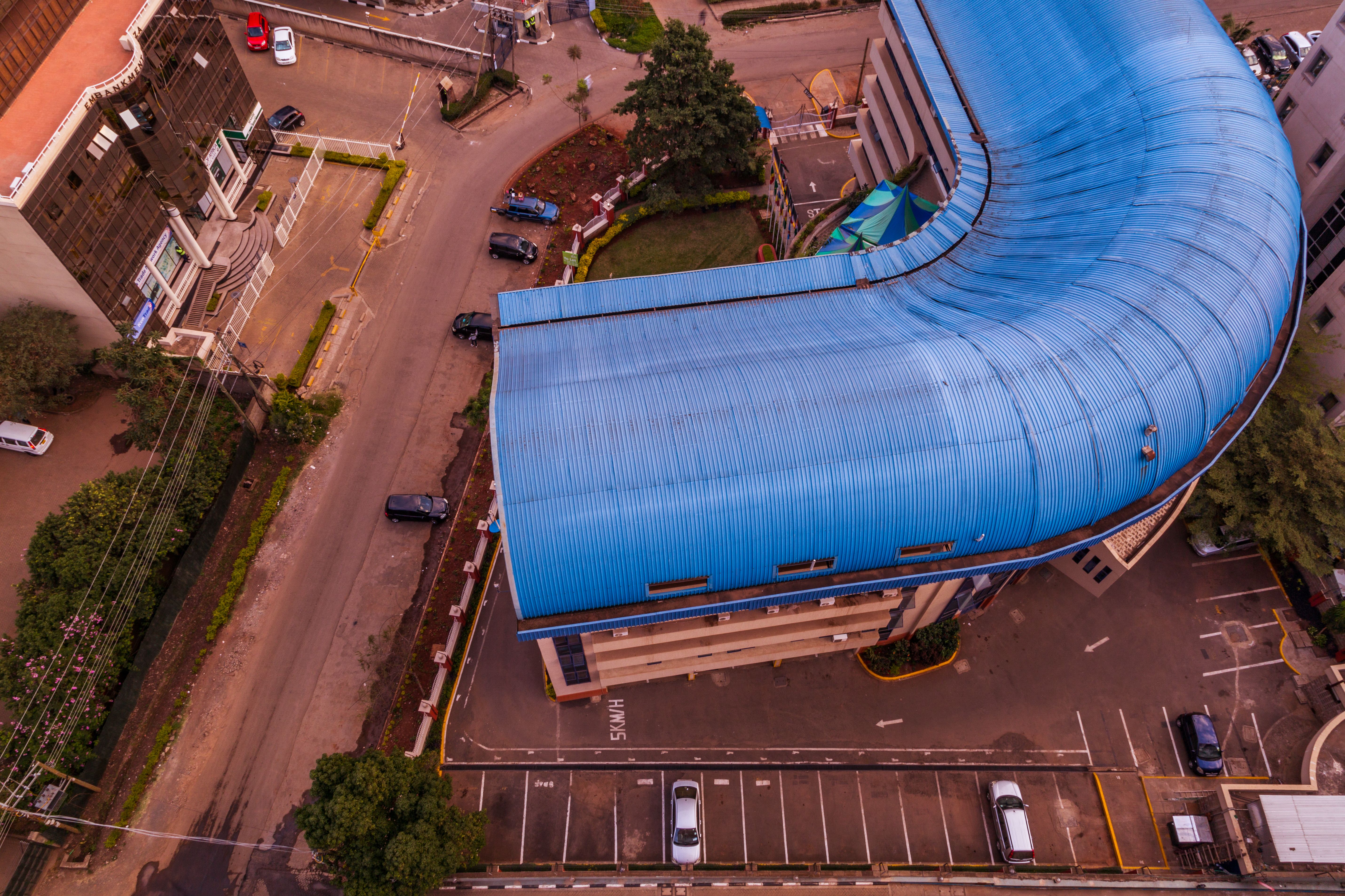 Aerial Photography of a Building with Blue Roof · Free Stock Photo
