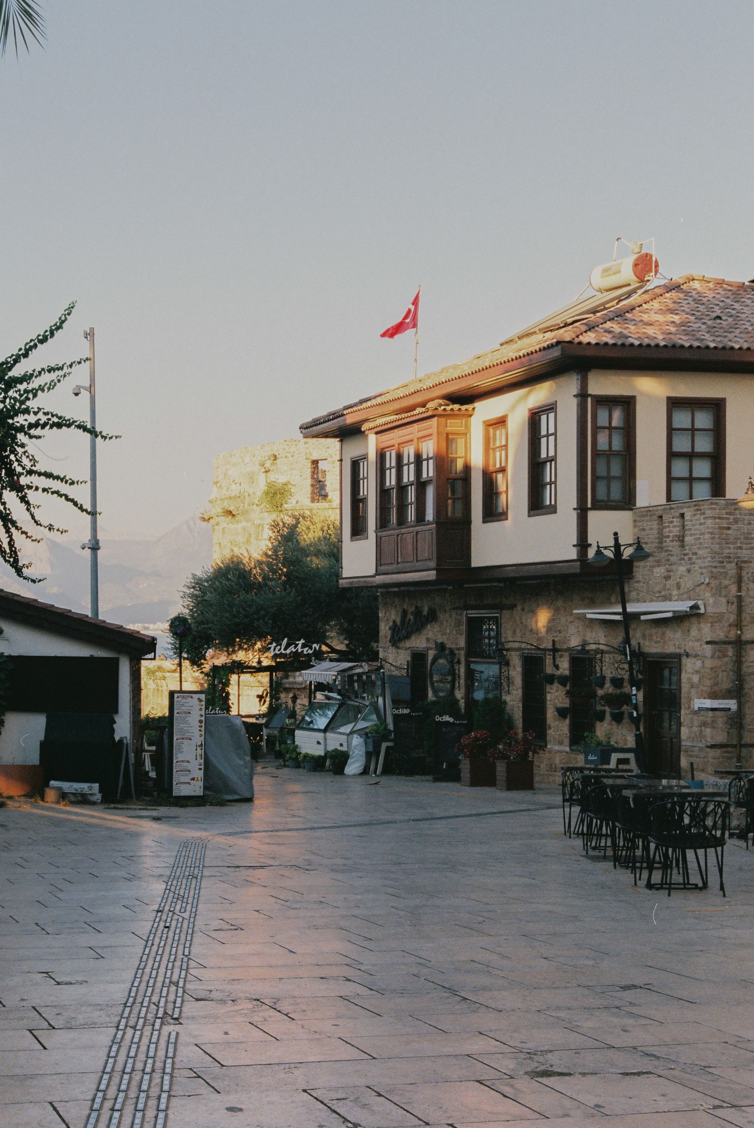 Crowded Sidewalk Cafes in a Town Square · Free Stock Photo