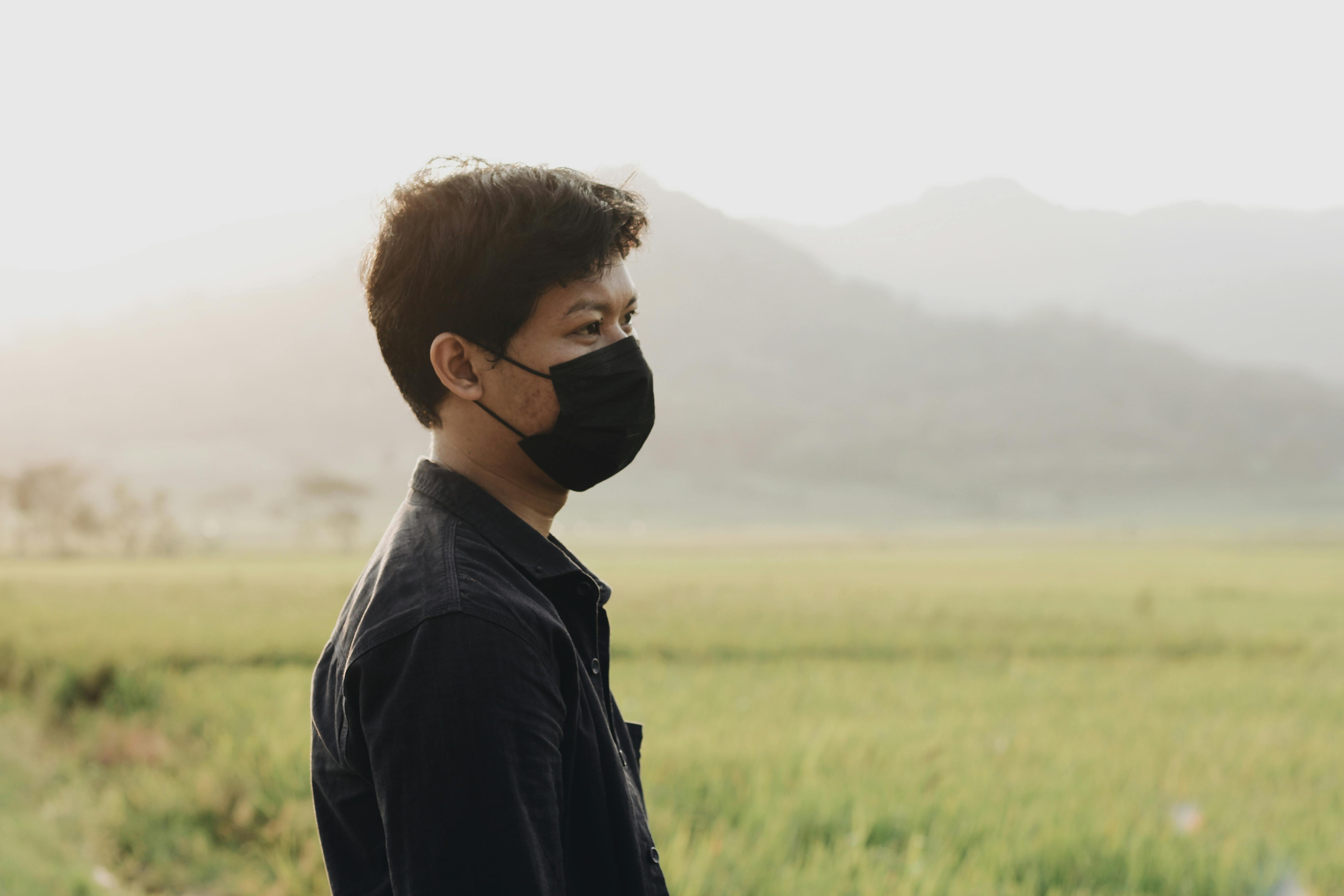 Black and White Photo of Person Looking at the Window · Free Stock Photo