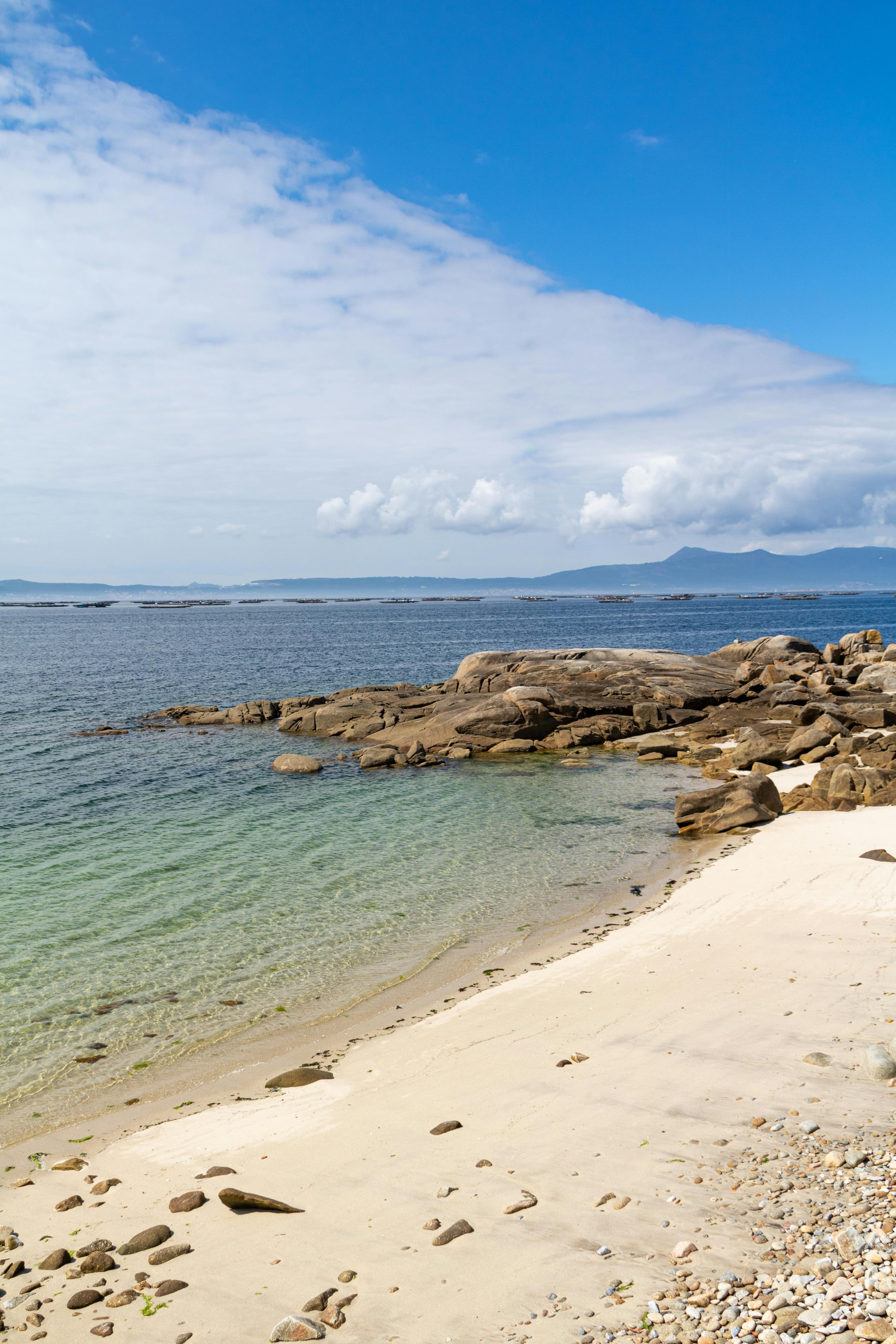Brown Rock Formation on Sea Shore · Free Stock Photo