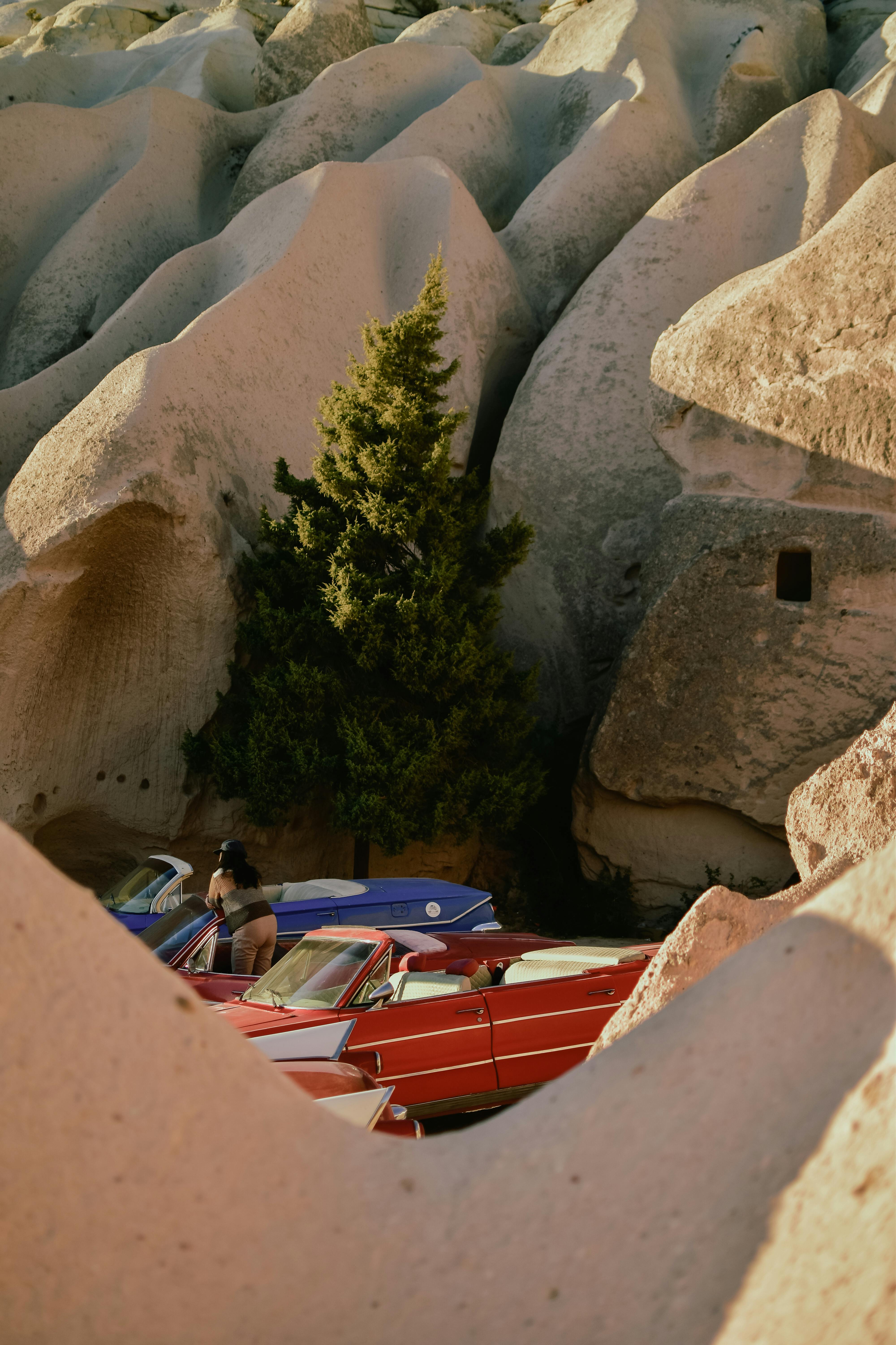 Retro Cars near Rock Formations · Free Stock Photo
