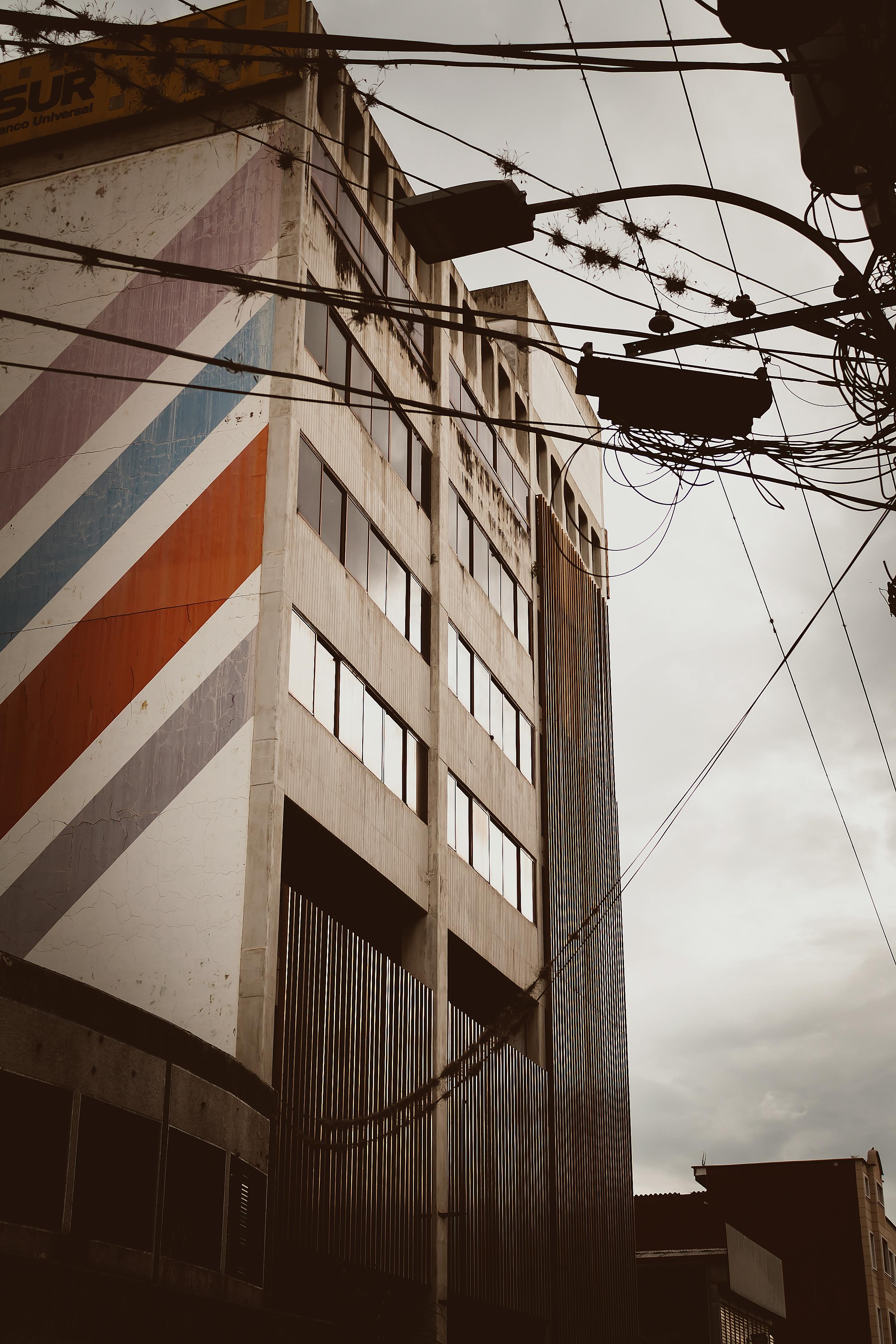 Power Lines near Building in Town · Free Stock Photo