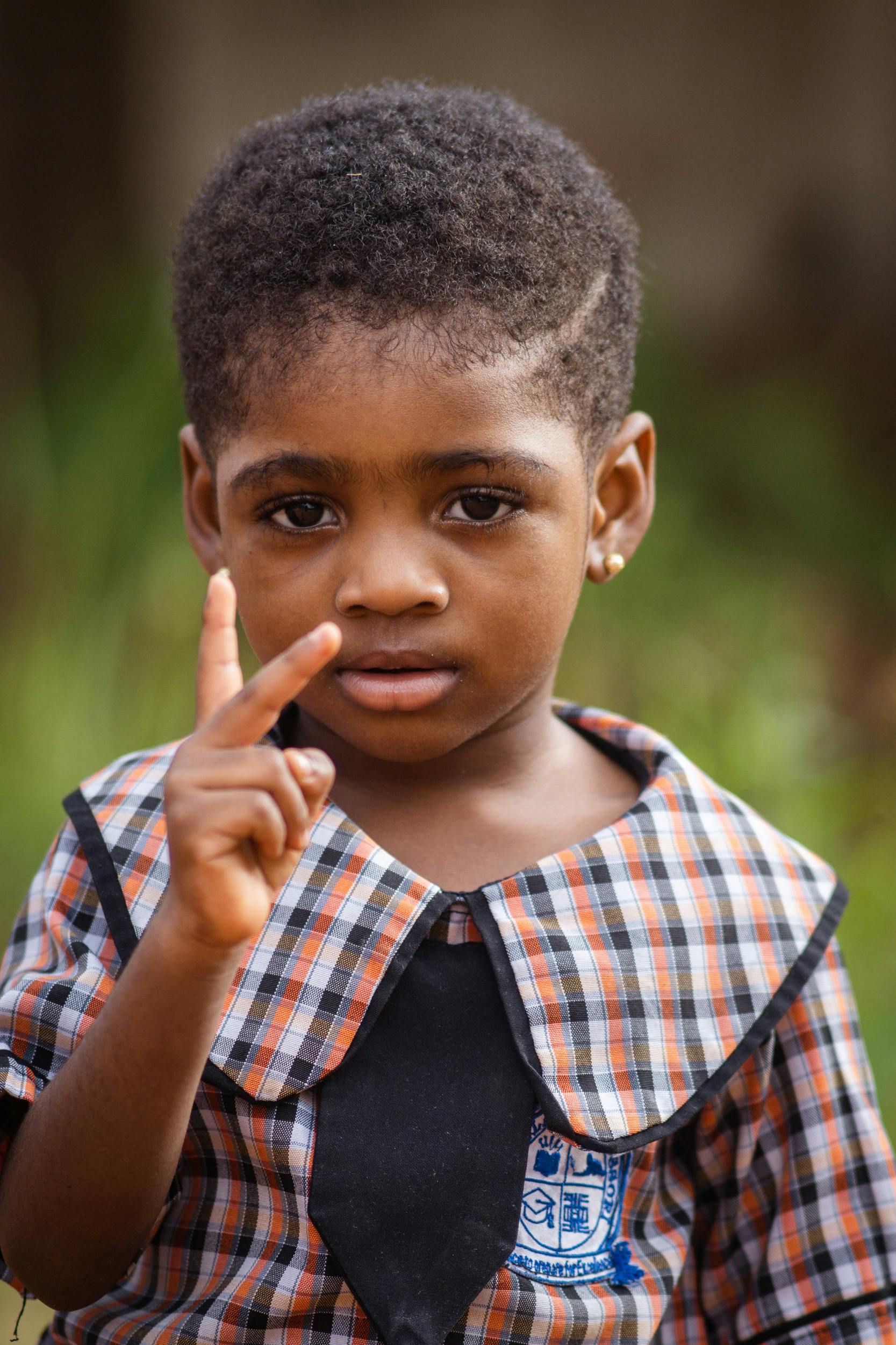 Smiling Children Making Gestures Posing Outdoors · Free Stock Photo