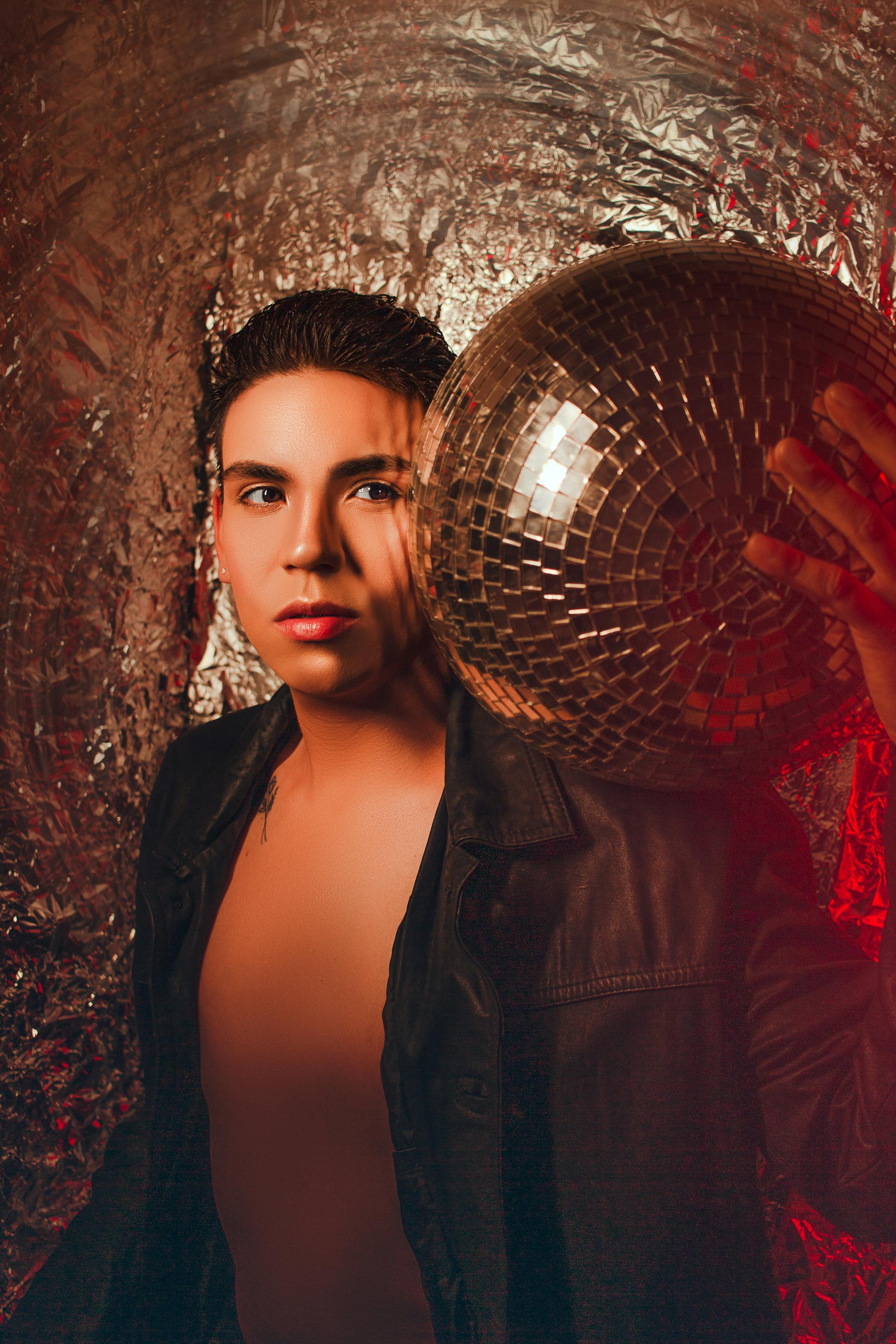 Photograph of a Man Holding a Disco Ball · Free Stock Photo