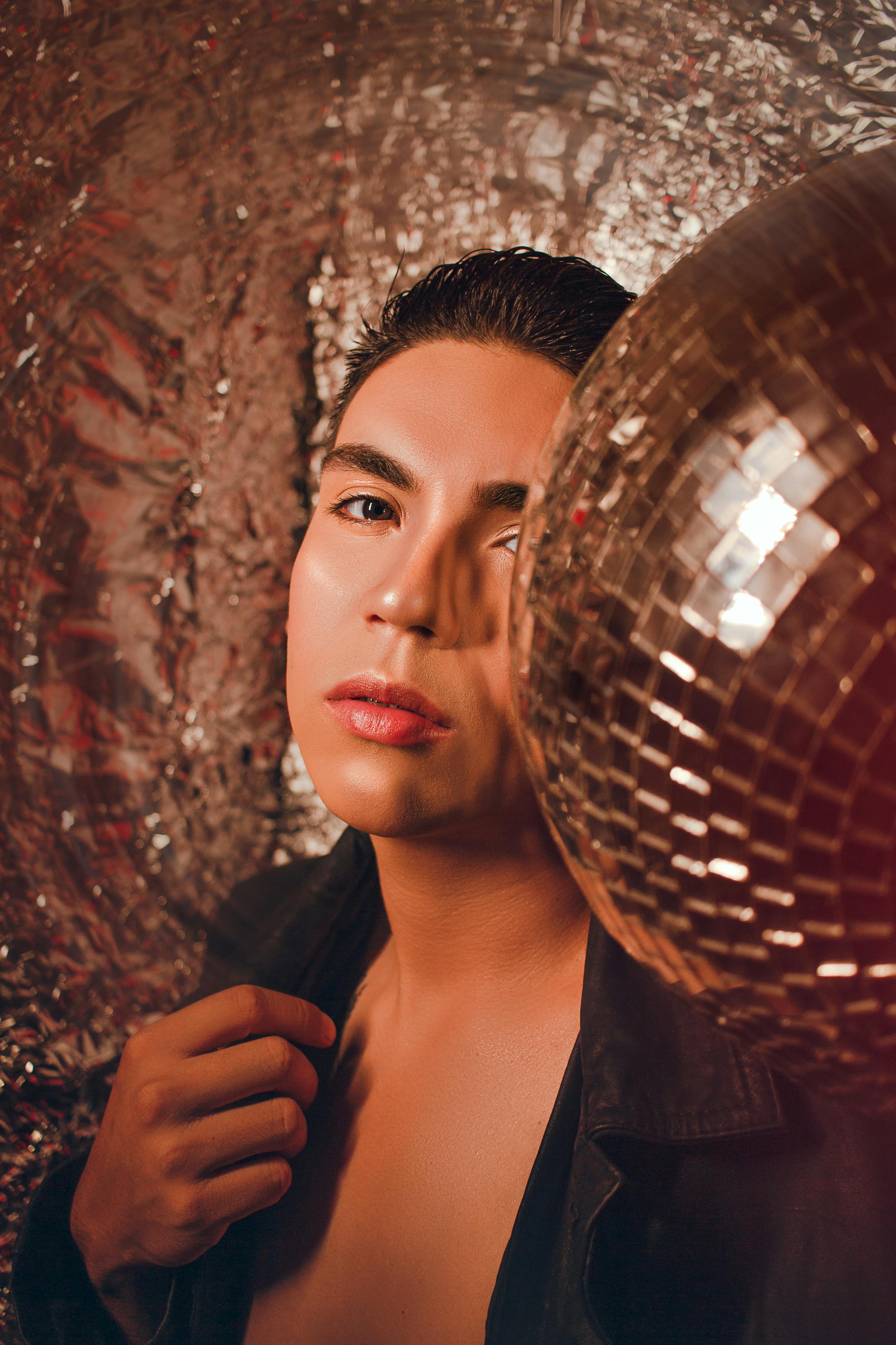 Portrait of a Man with a Disco Ball · Free Stock Photo