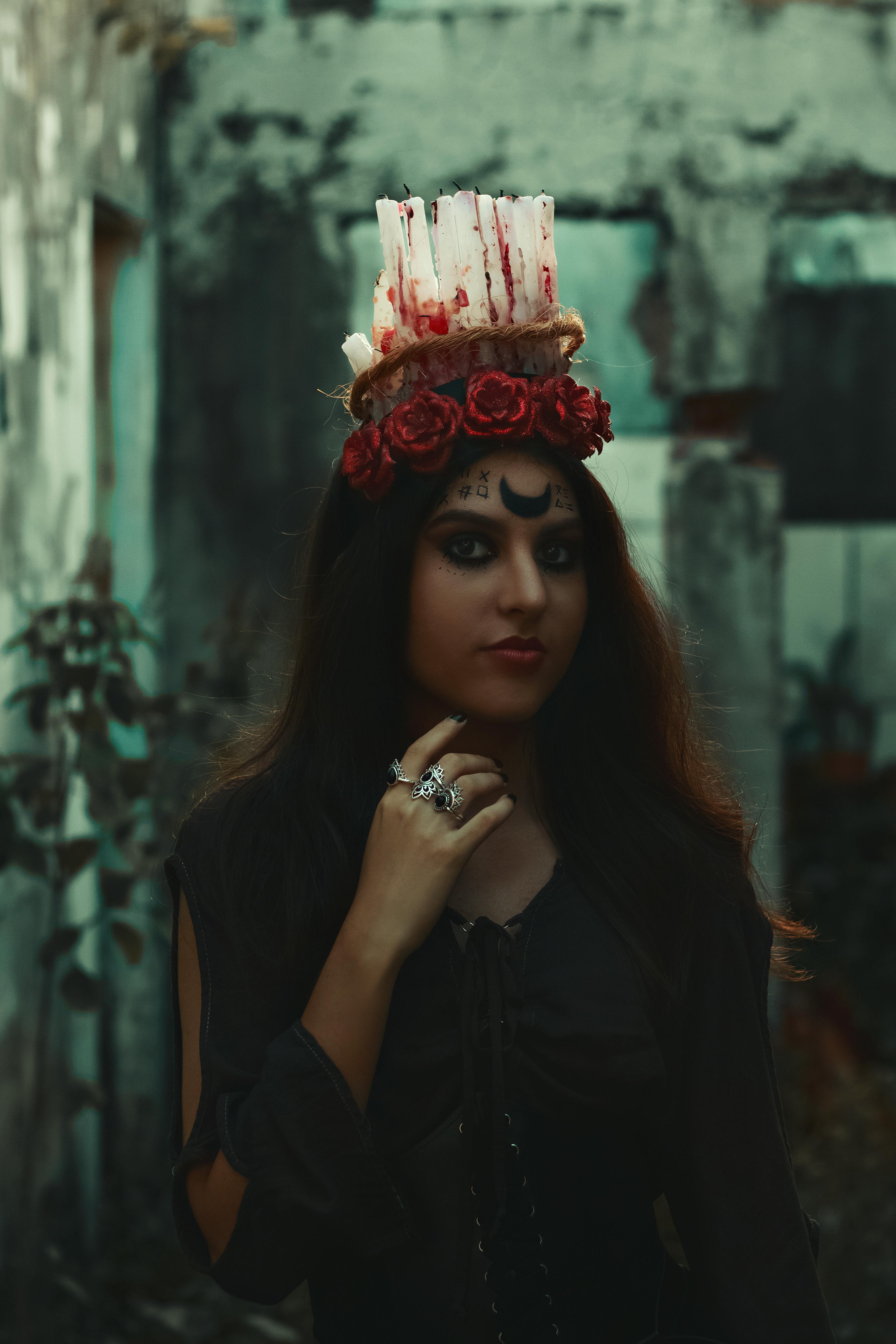 Woman in Black Dress Wearing a Spiky Headdress · Free Stock Photo