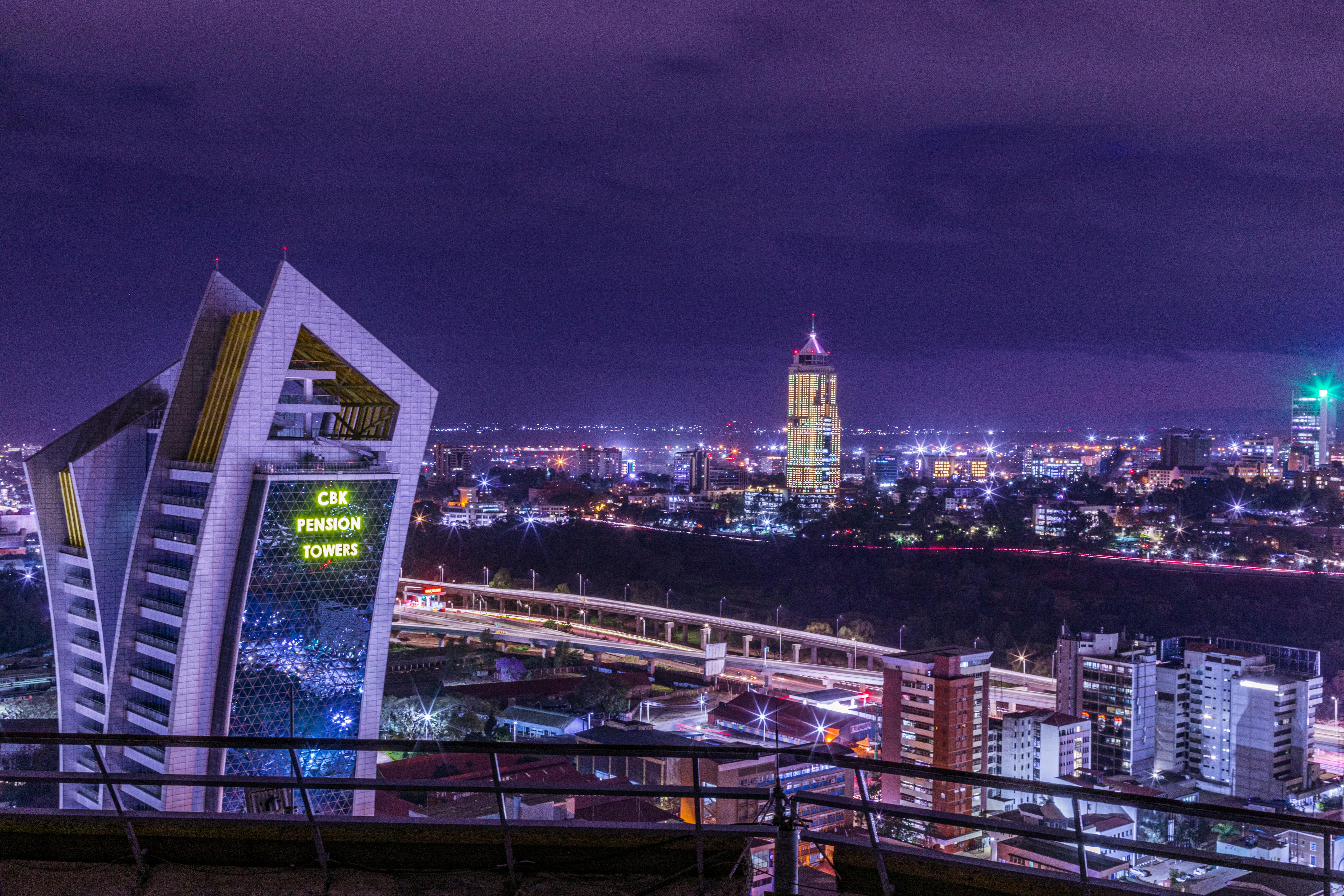 A Scenic View of City Buildings at Night · Free Stock Photo