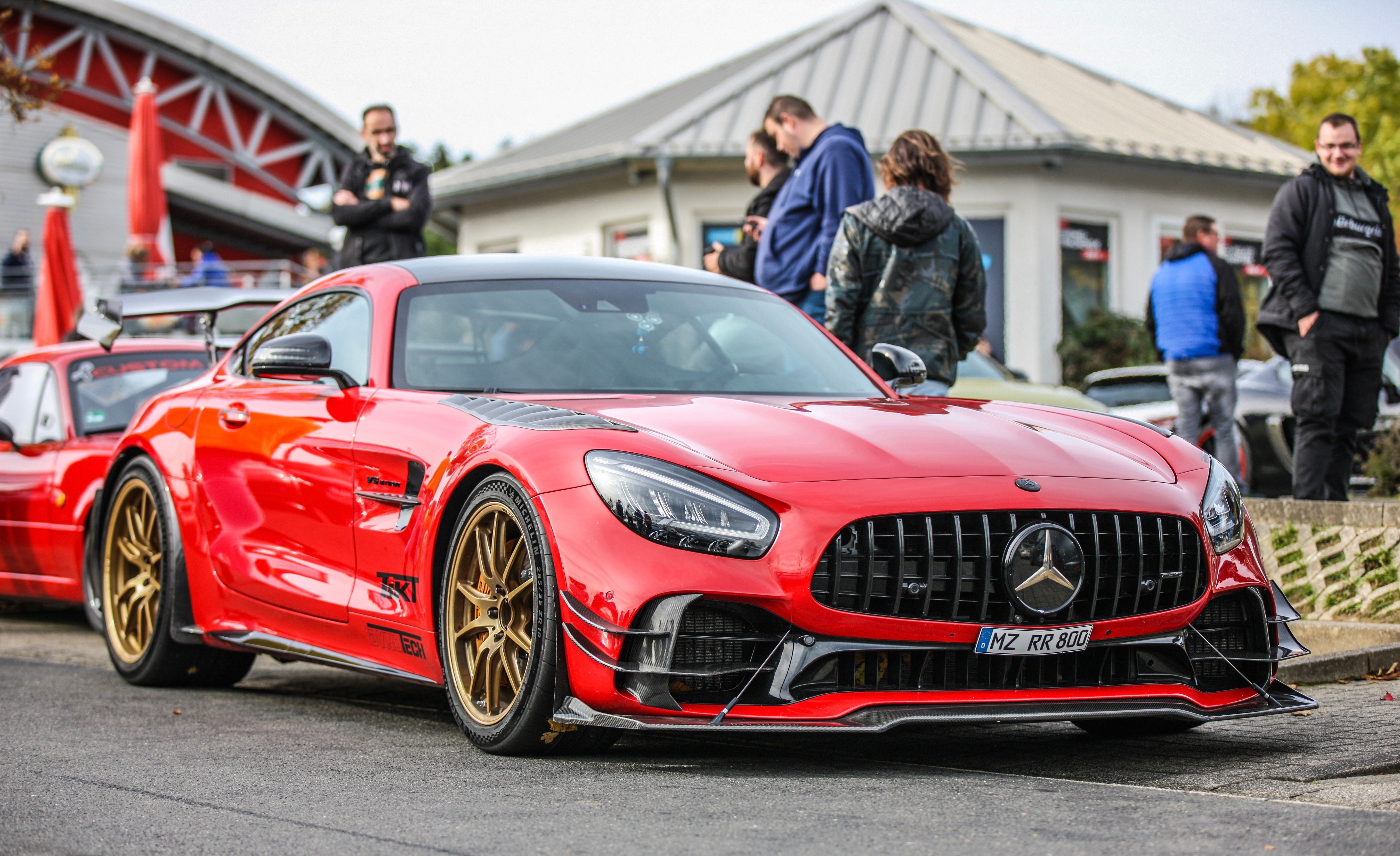 People Standing Near Red Mercedes Benz Car · Free Stock Photo
