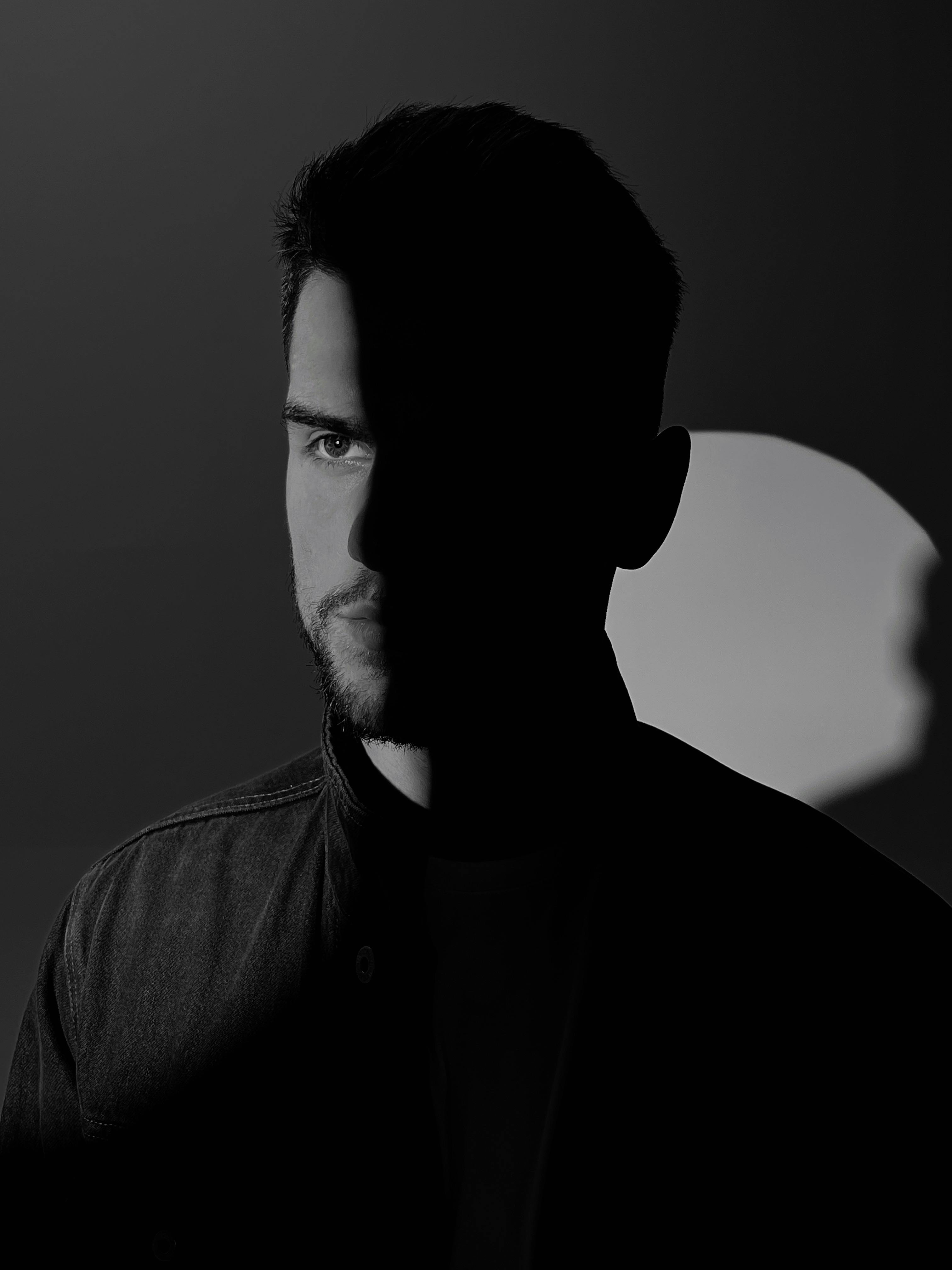 Grayscale Photography of a Man Looking Afar · Free Stock Photo