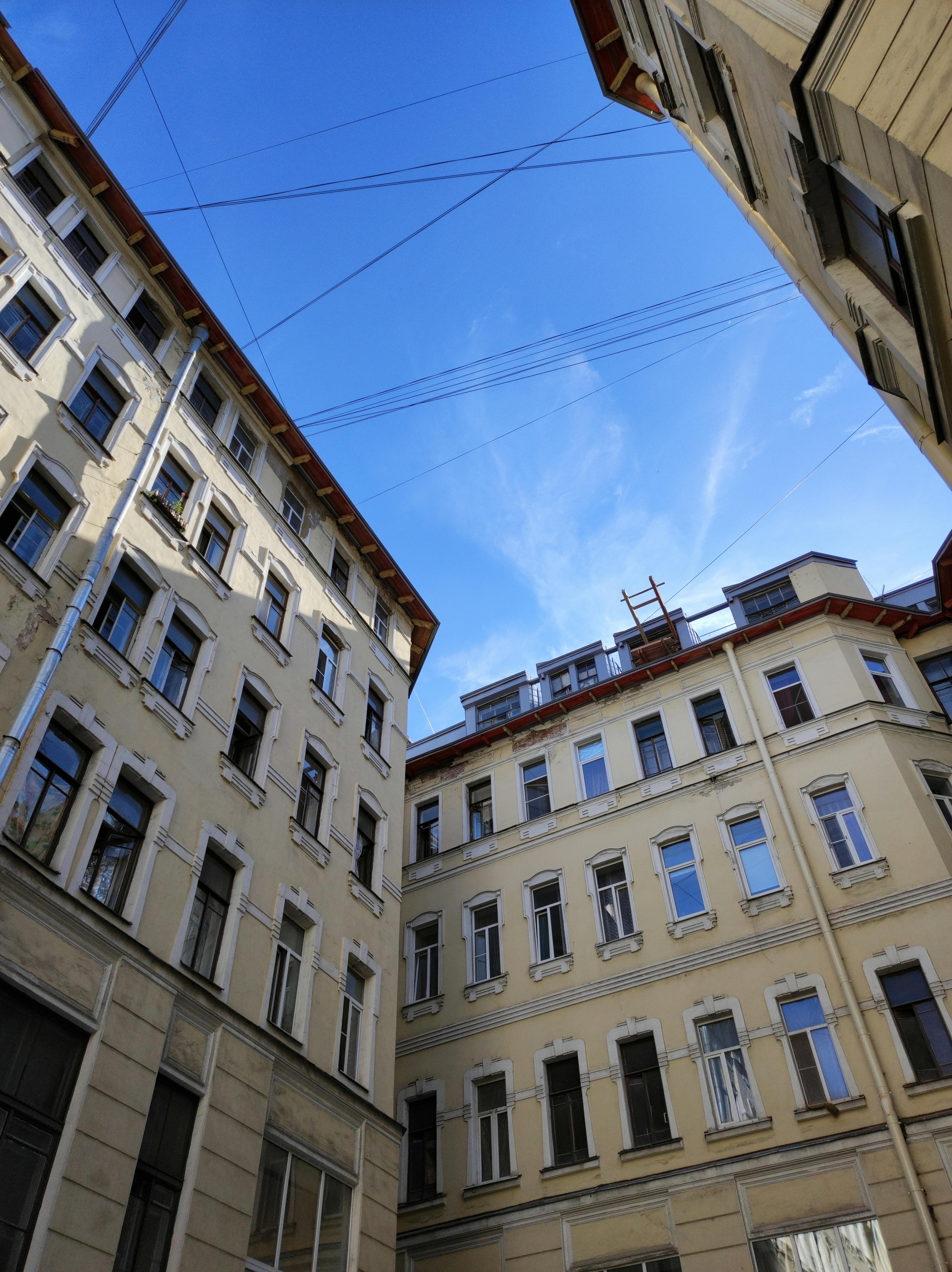 Wide Angle Shot of a Blue Residential Building on the Corner of a ...