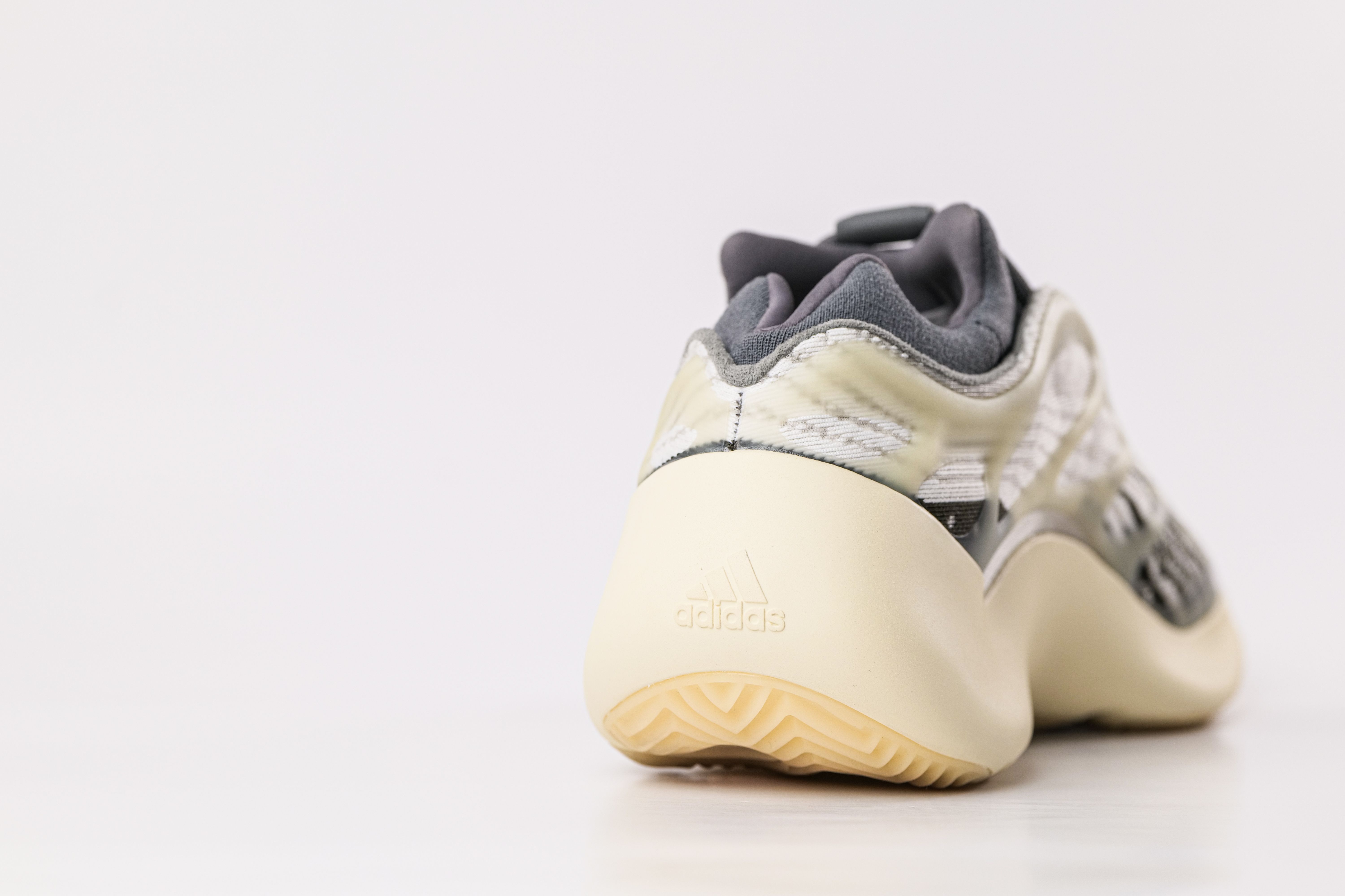 Close-Up Shot of a Sports Shoe on White Surface · Free Stock Photo