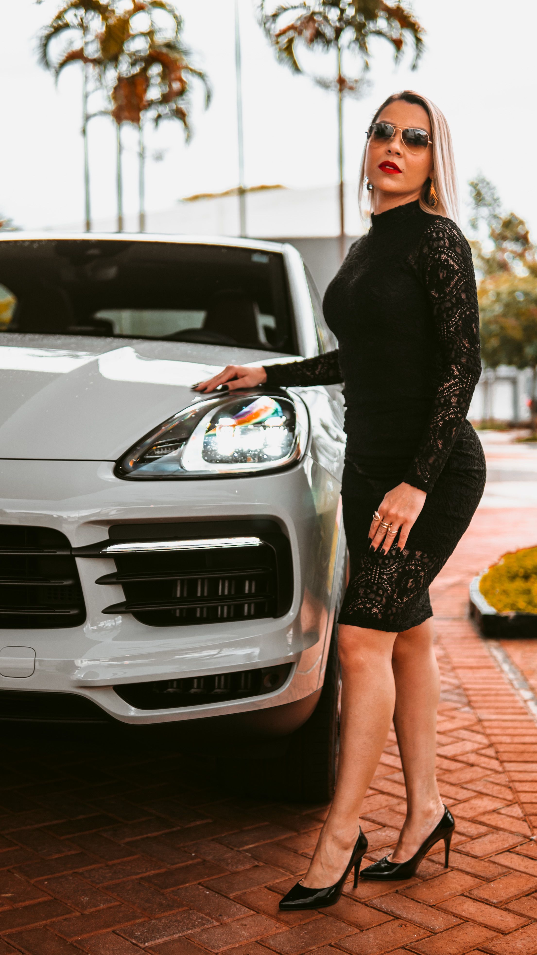 Woman Standing in Front of a Car · Free Stock Photo