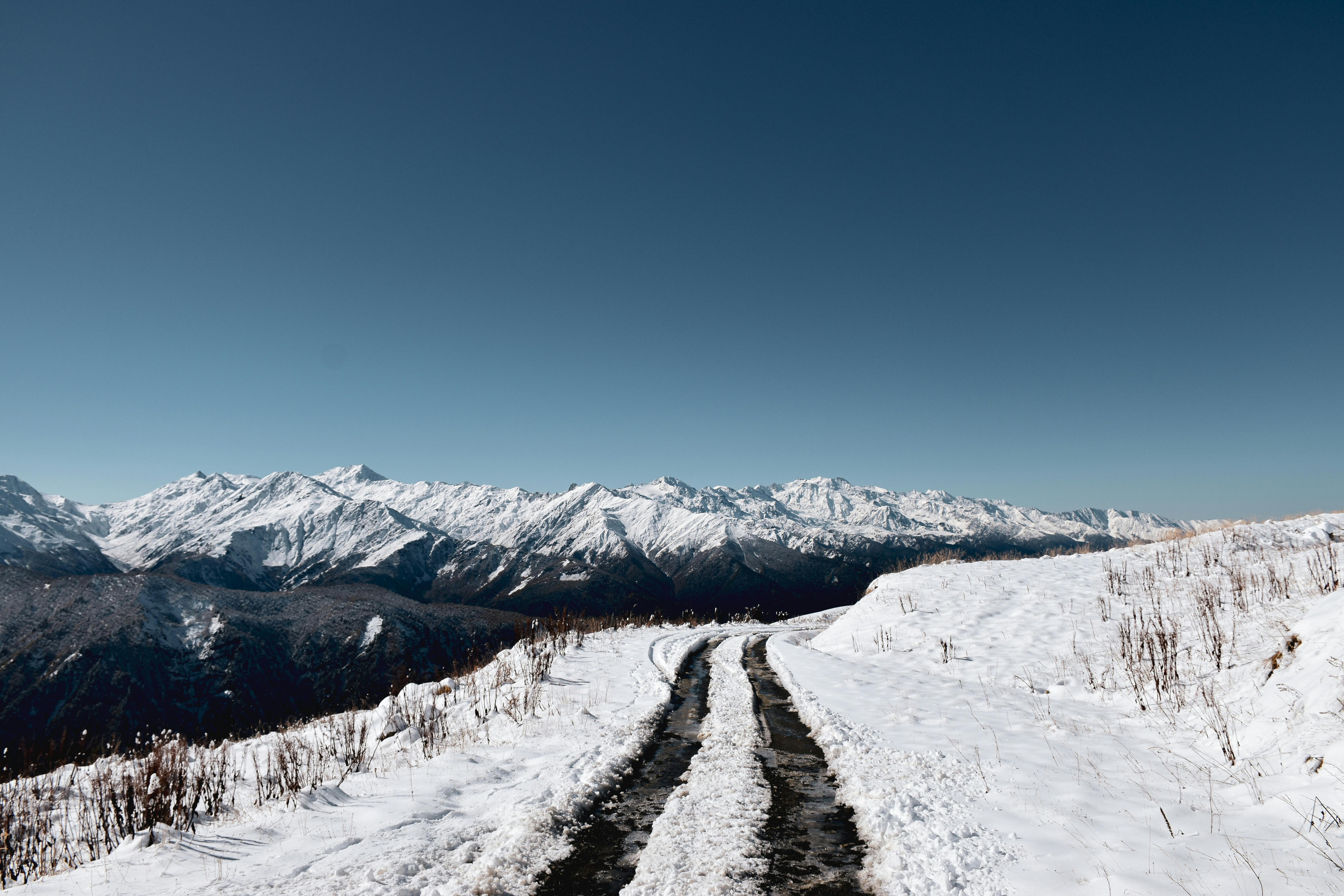 Snow Covered Road Near Mountain · Free Stock Photo