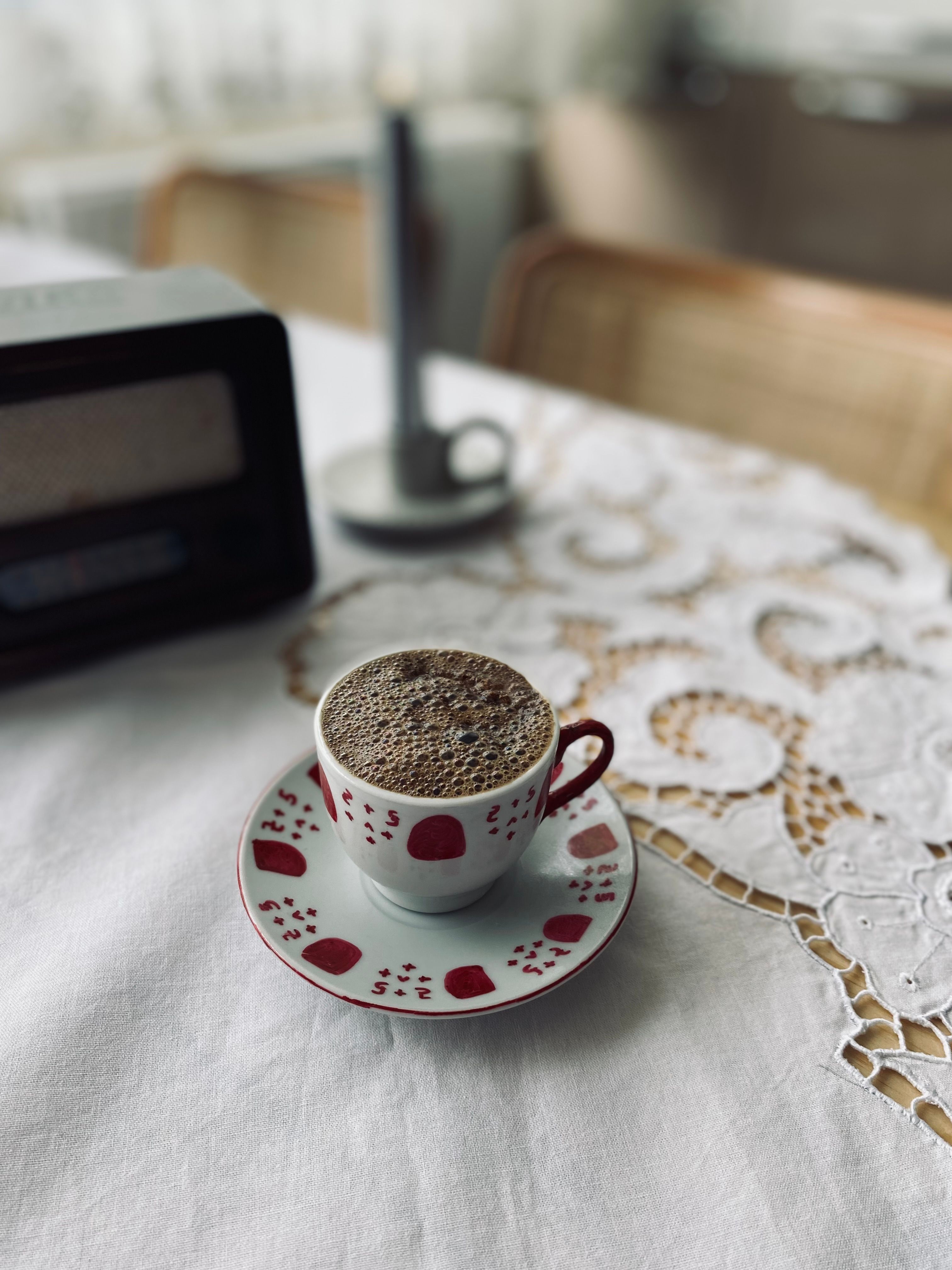 A Cup of Coffee on a White Table · Free Stock Photo