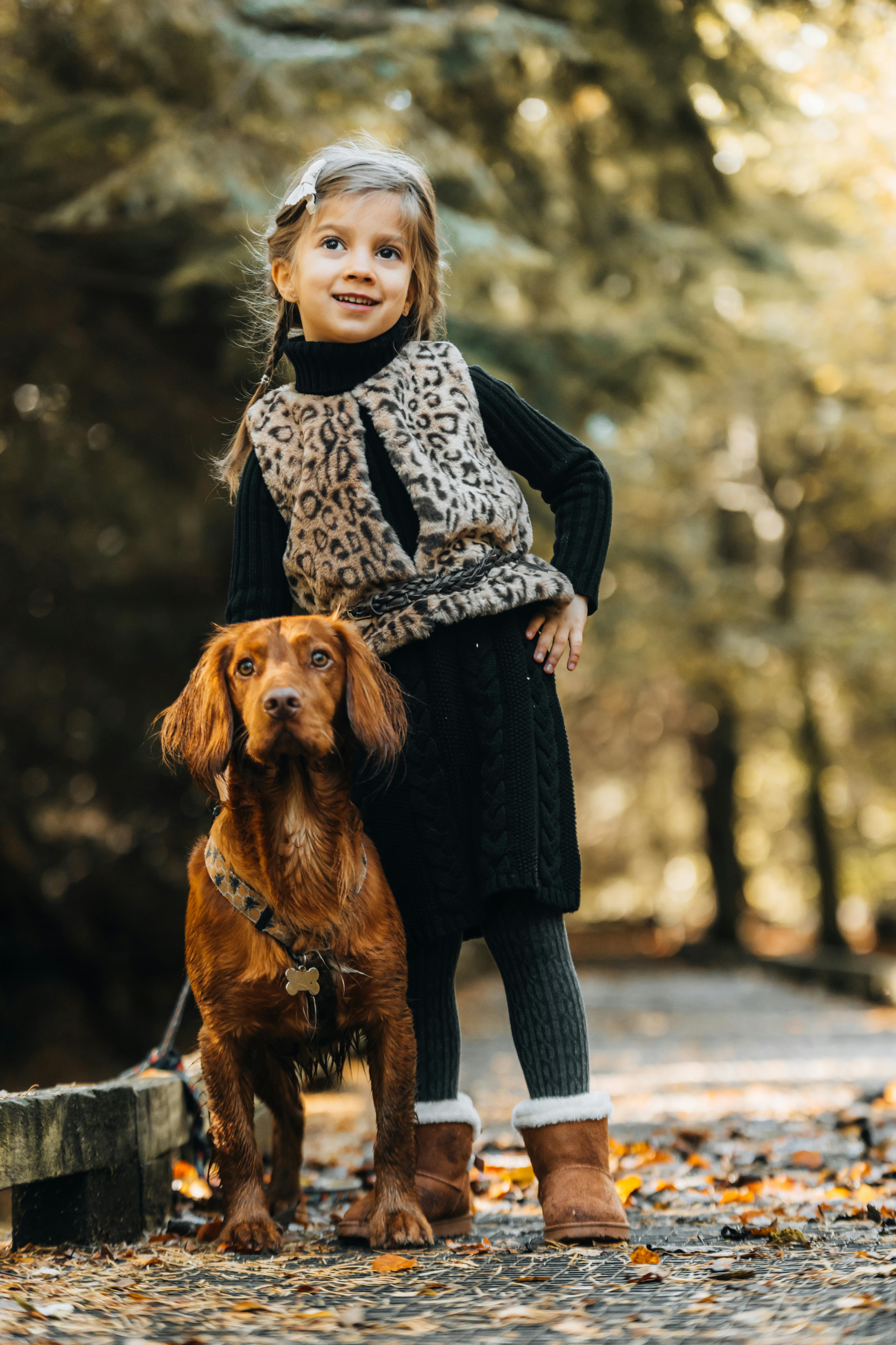 Girl Standing Beside a Dog · Free Stock Photo