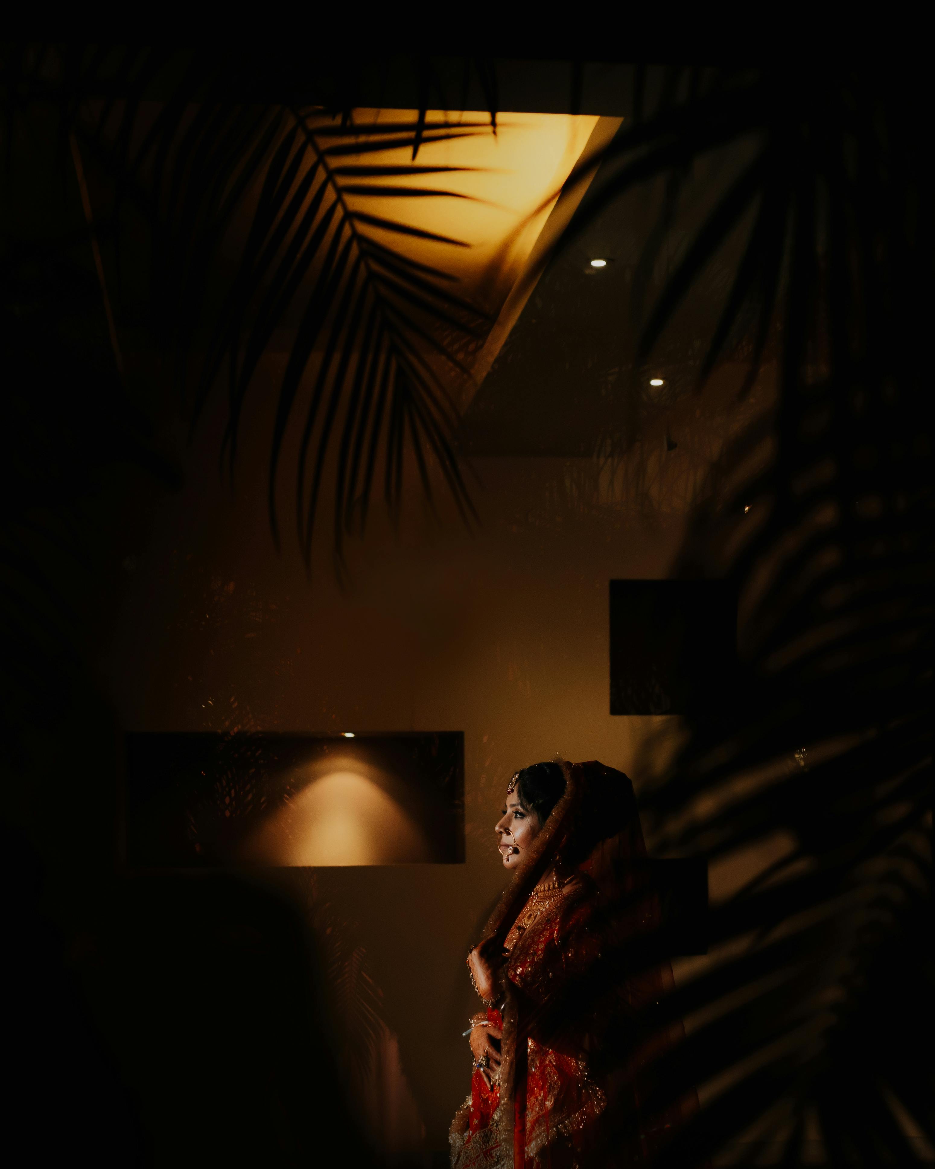 A Beautiful Bride Wearing Red Lehenga Looking Afar · Free Stock Photo